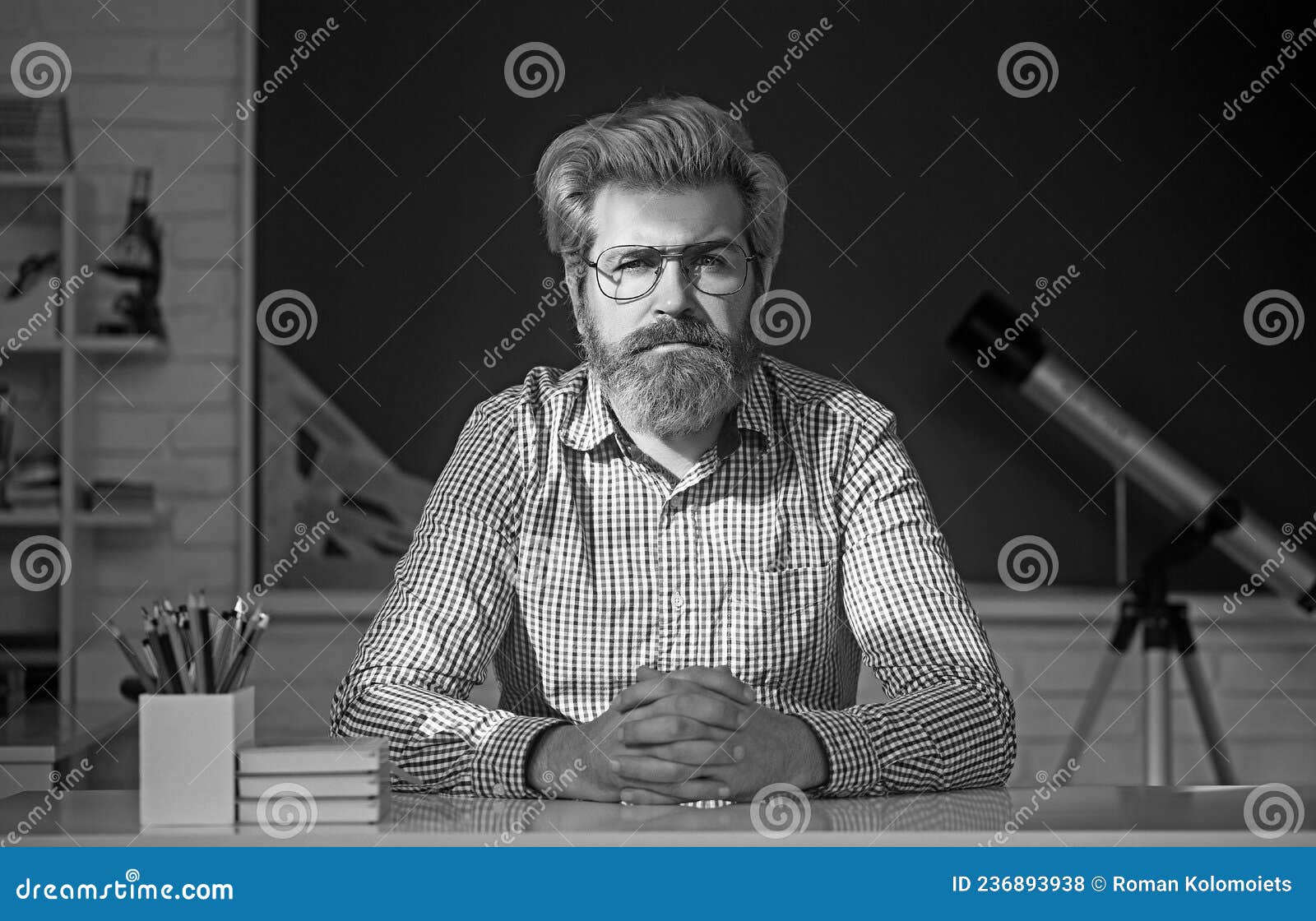 Teacher Giving Lesson To Students in Classroom. Stock Photo - Image of ...