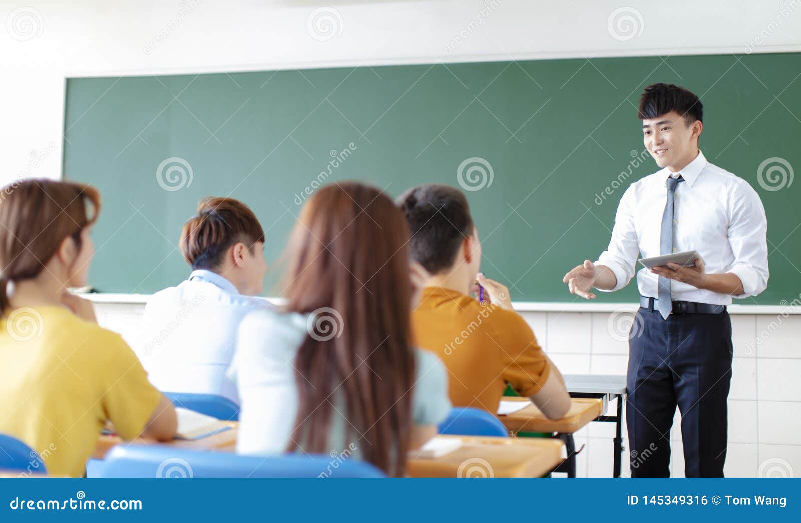 Teacher with Group of College Students in Classroom Stock Photo - Image ... Teacher with Group of College Students in Classroom Stock Photo - Image ...