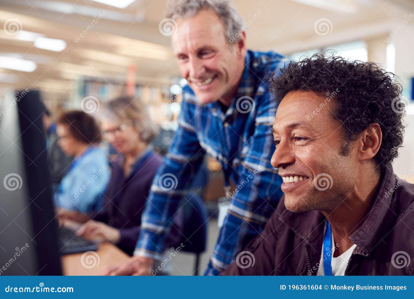 Group Of Mature Adults Attending Art Class In Community Centre With ...