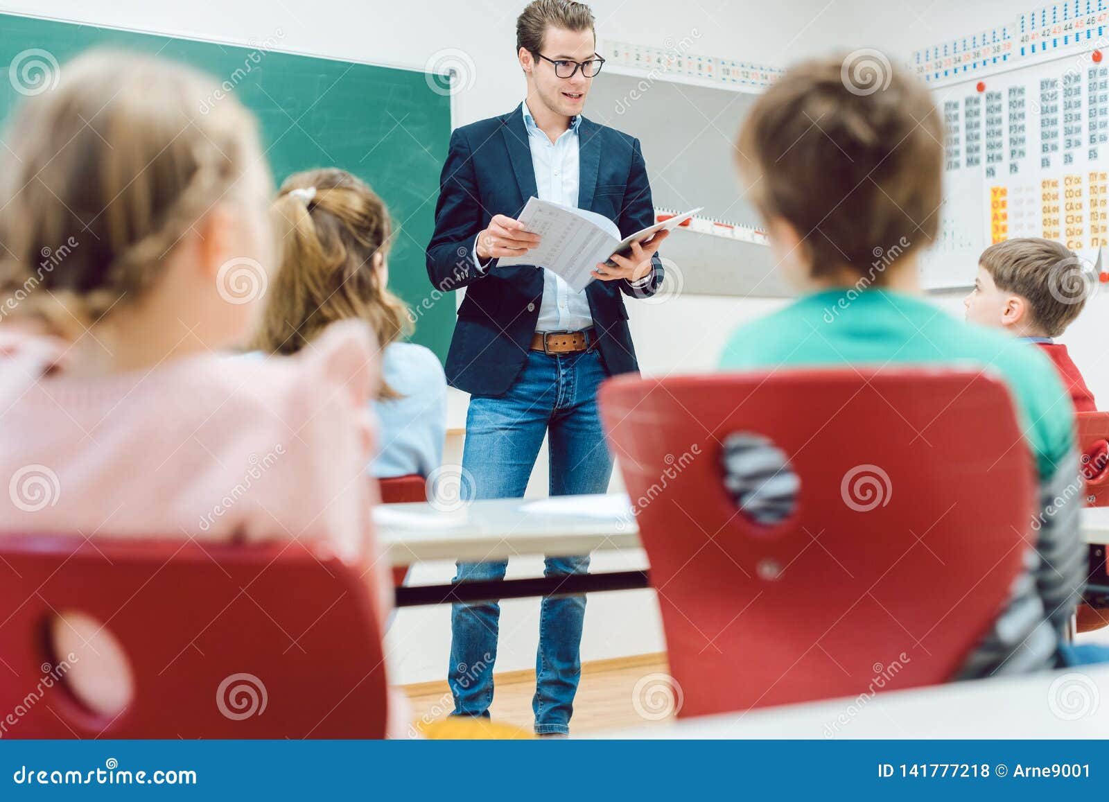 Teacher Handing Back Written Tests To the Class Stock Photo - Image of ...