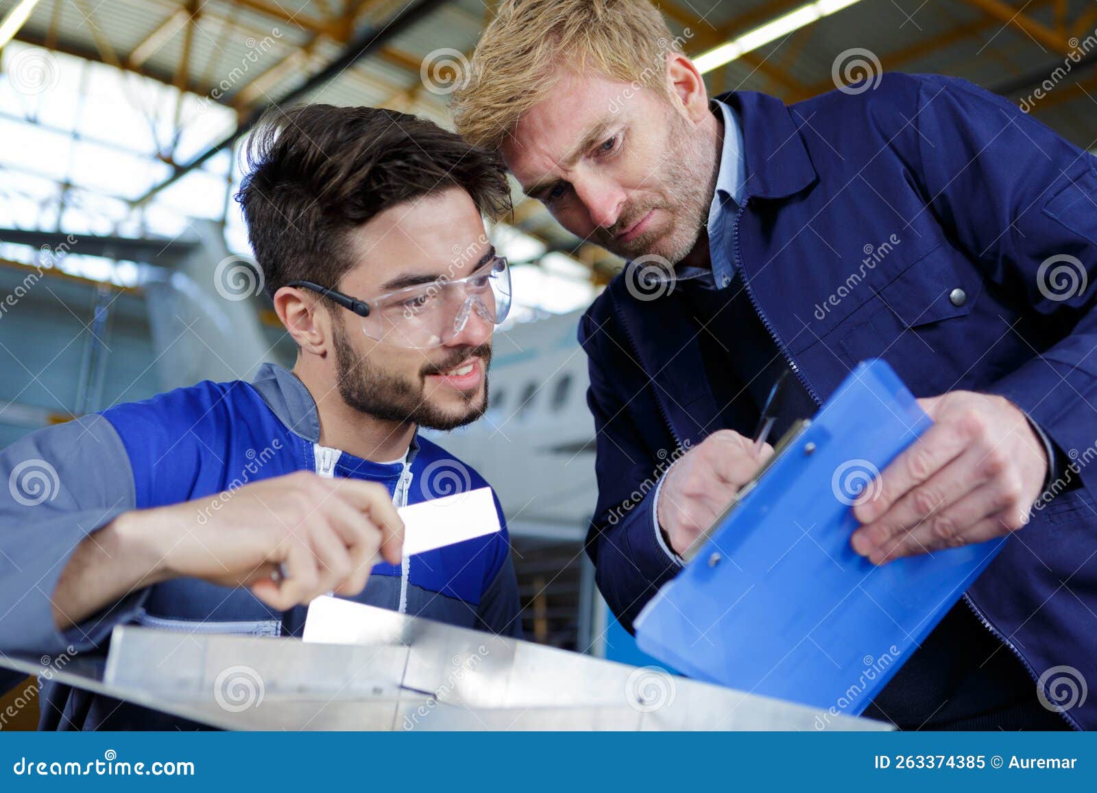 Teacher Helping Apprentice Mechanic Stock Image - Image of mechanic ...