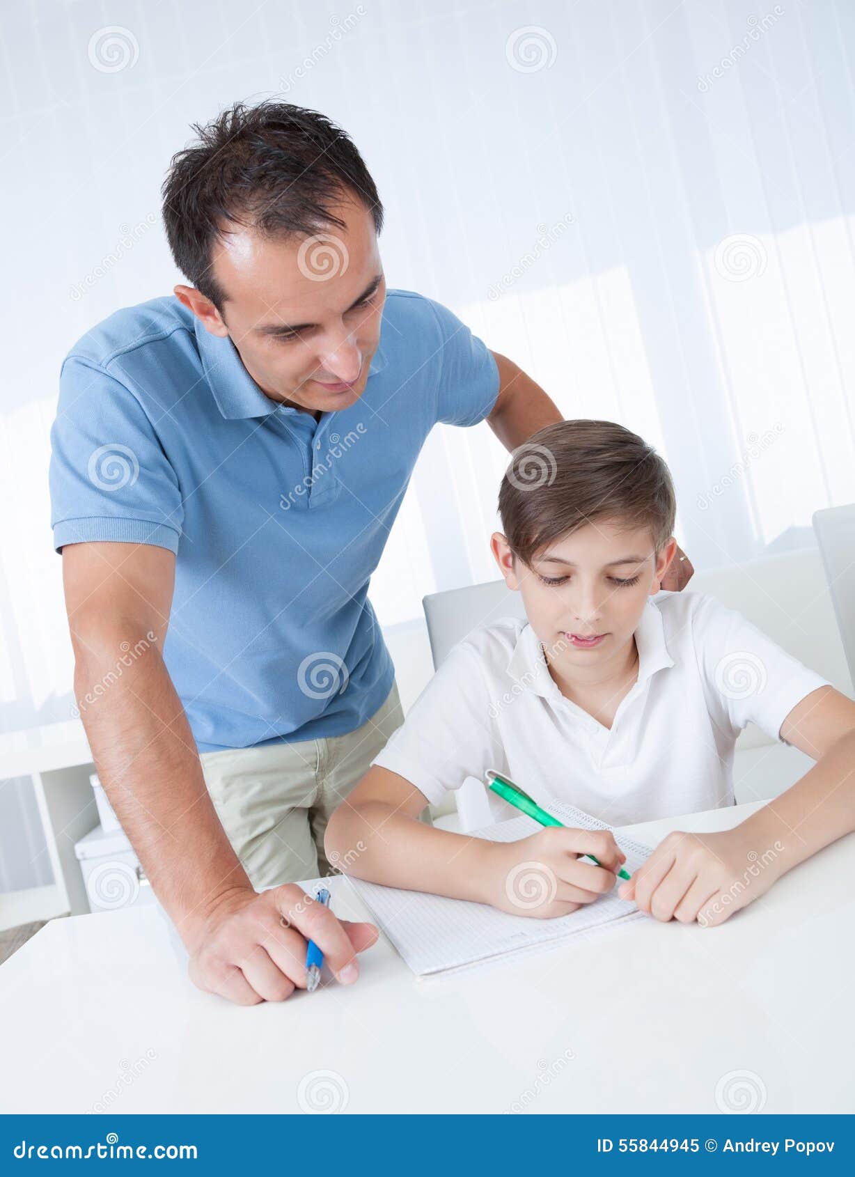Teacher Helping Boy with Exercise Stock Image - Image of book, happy ...