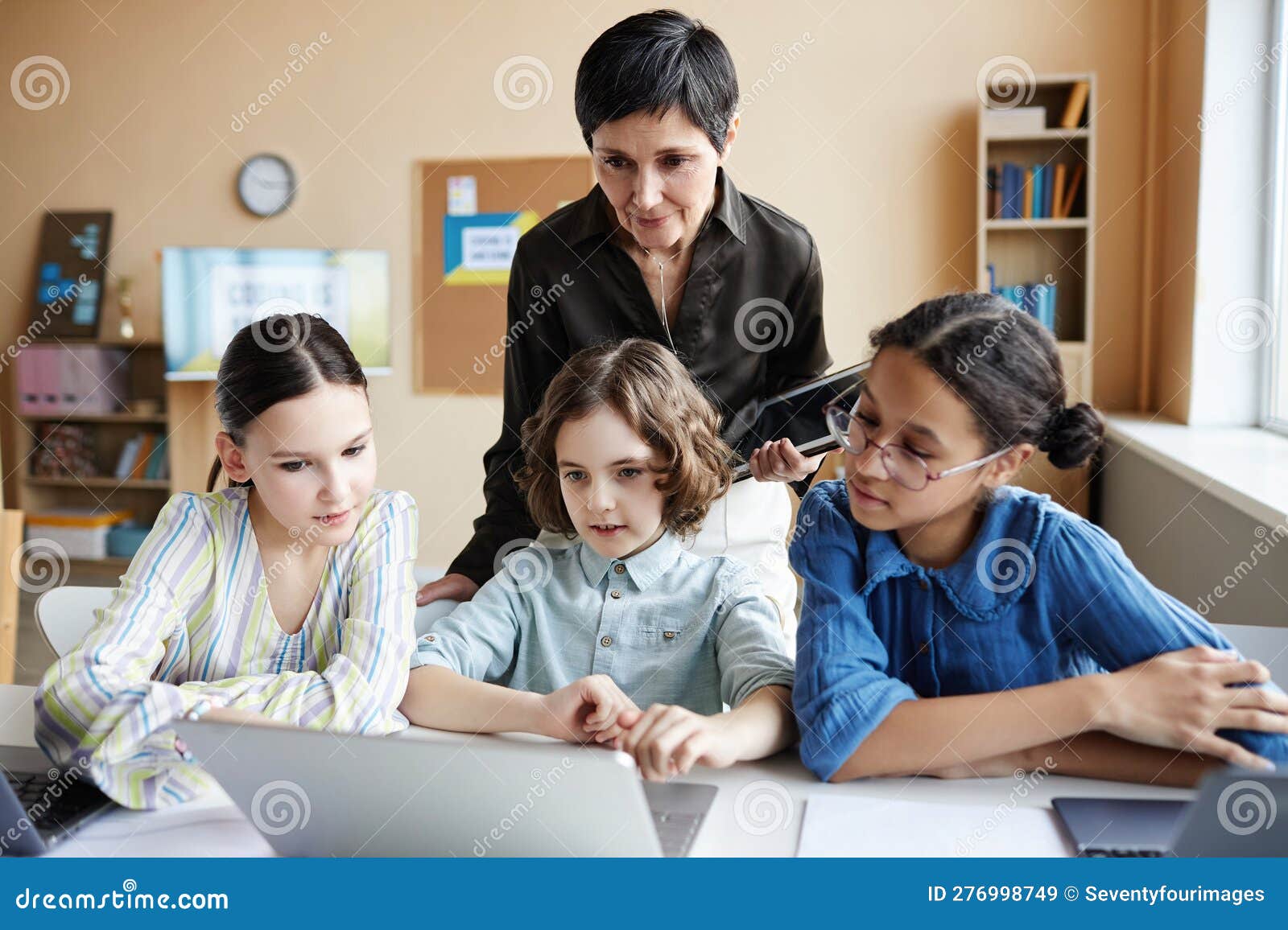 Teacher Helping Children with Online Presentation Stock Image - Image ...