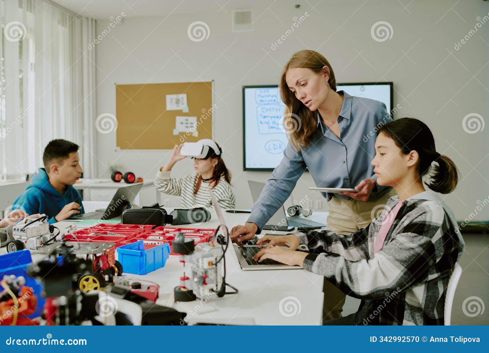 Teacher Helping with Codes stock photo. Image of touchpad - 342992570