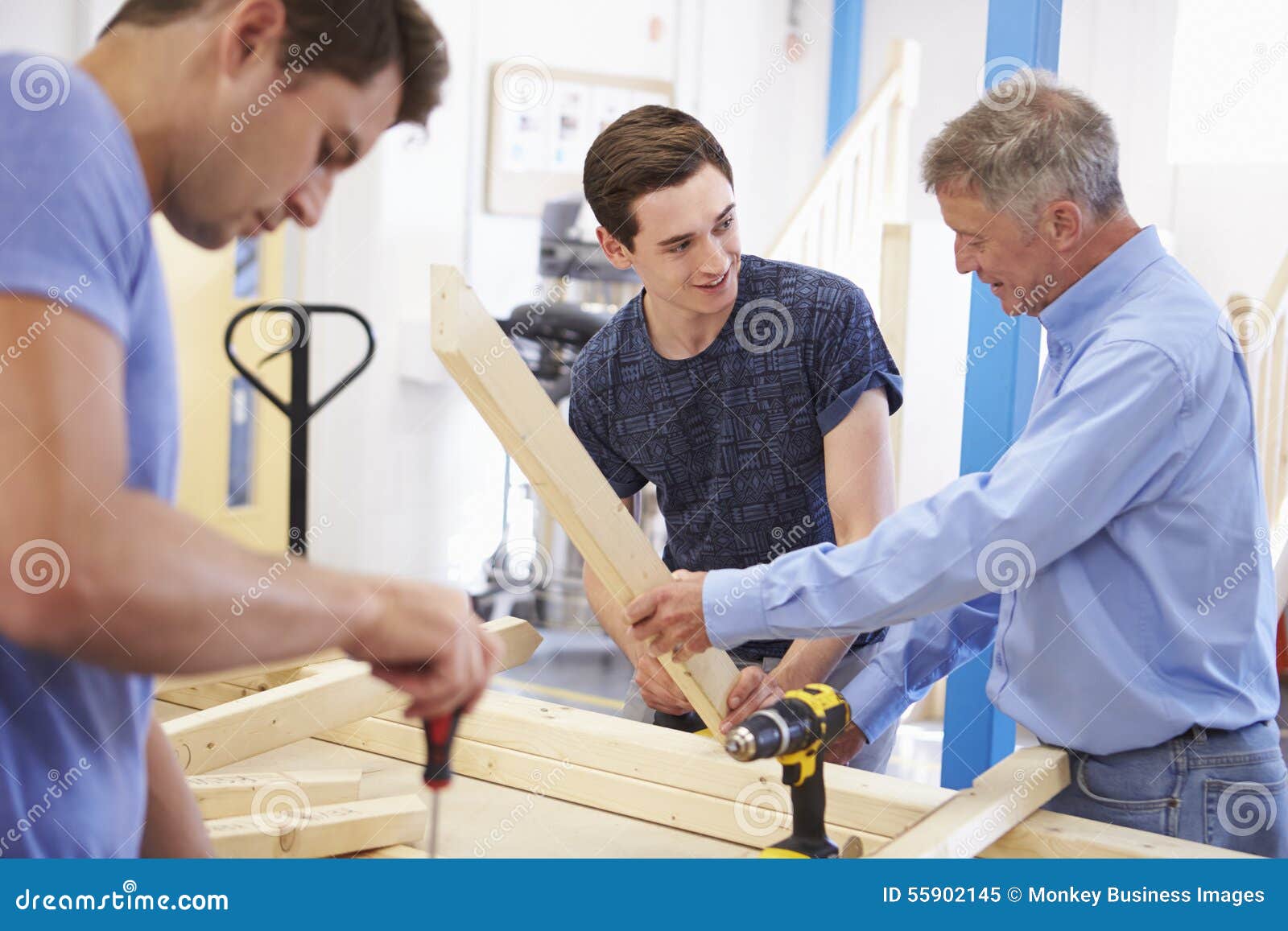 Teacher Helping College Student Studying Carpentry Stock Image - Image ...