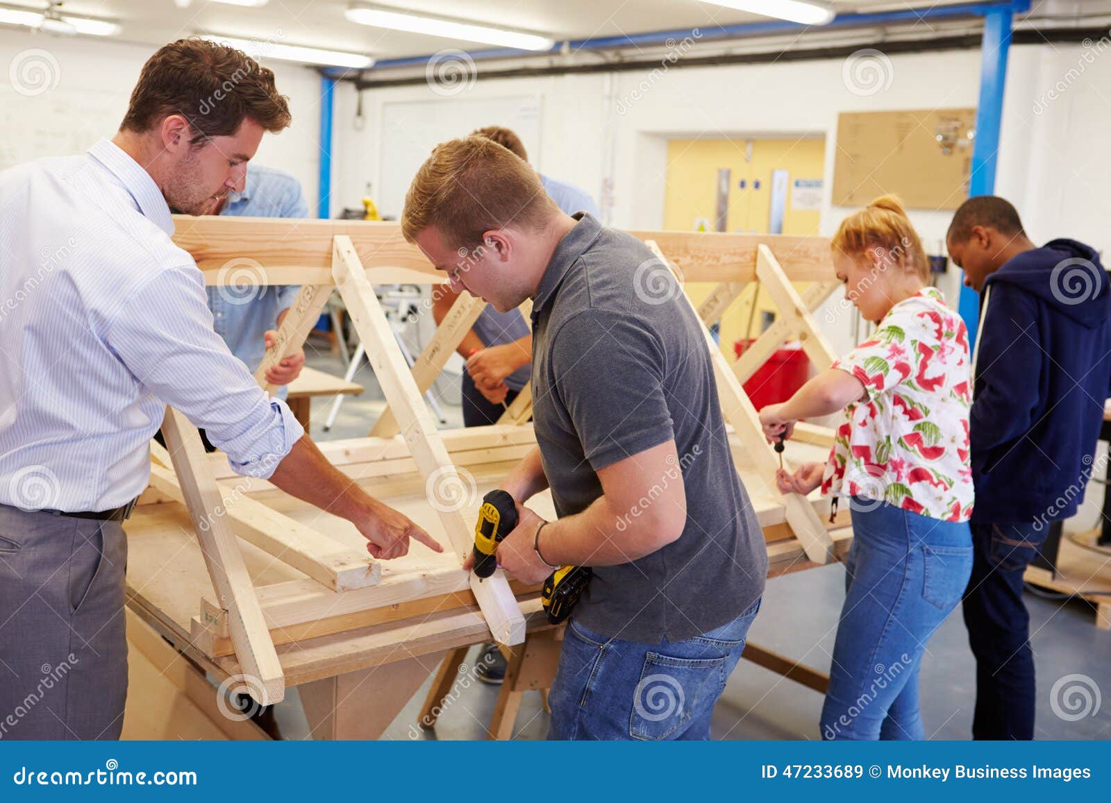 Teacher Helping College Students Studying Carpentry Stock Image - Image ...