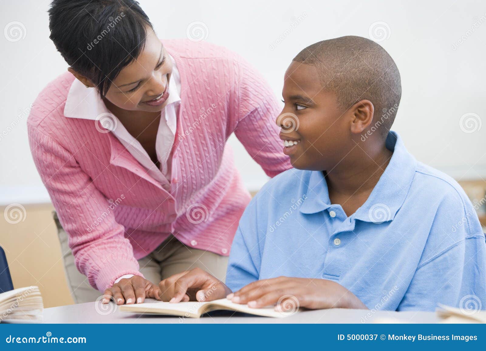 Teacher Helping Elementary School Pupil Stock Image - Image of aged ...