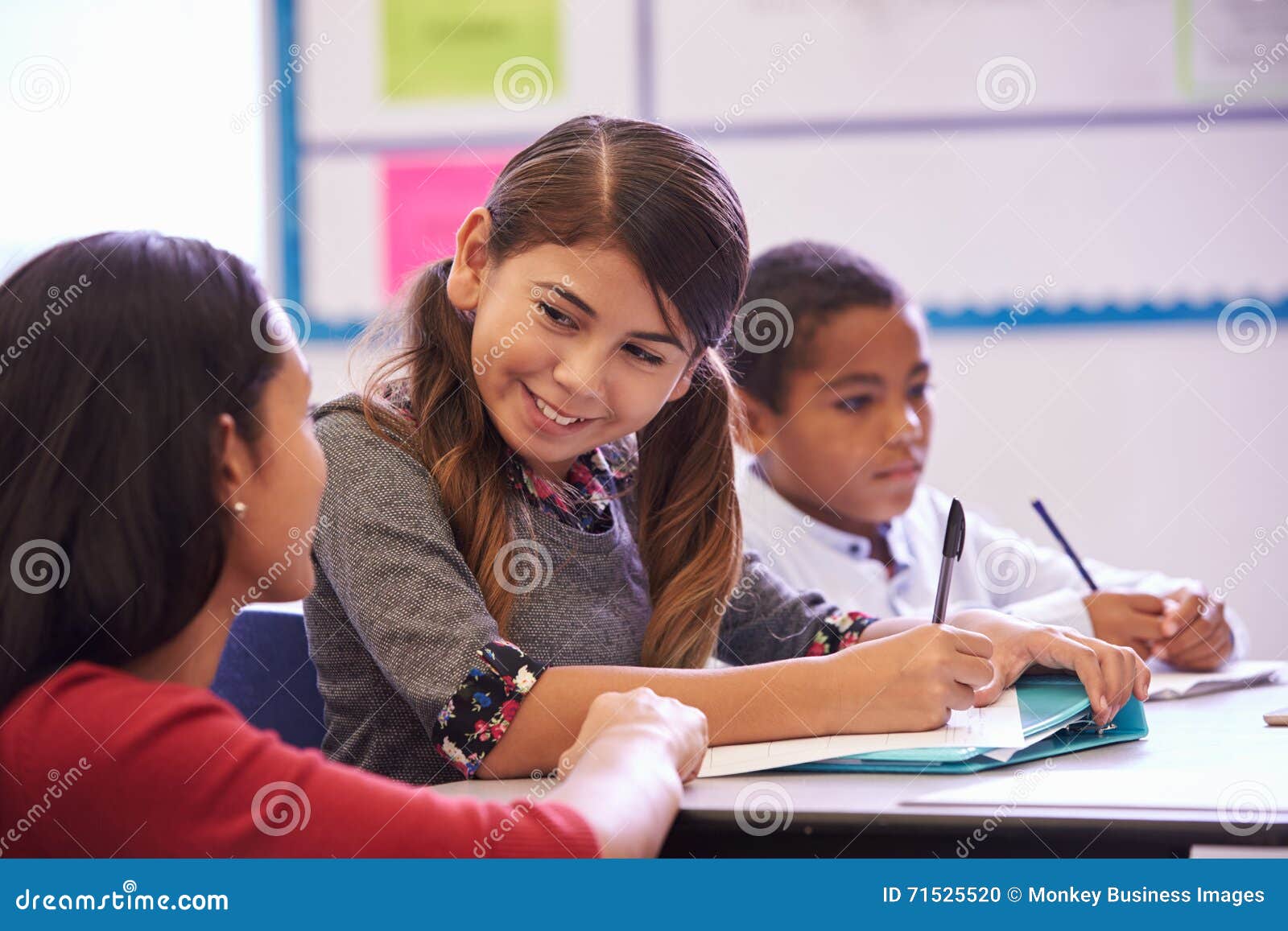 Teacher Helping Elementary School Pupils in Class Stock Photo - Image ...