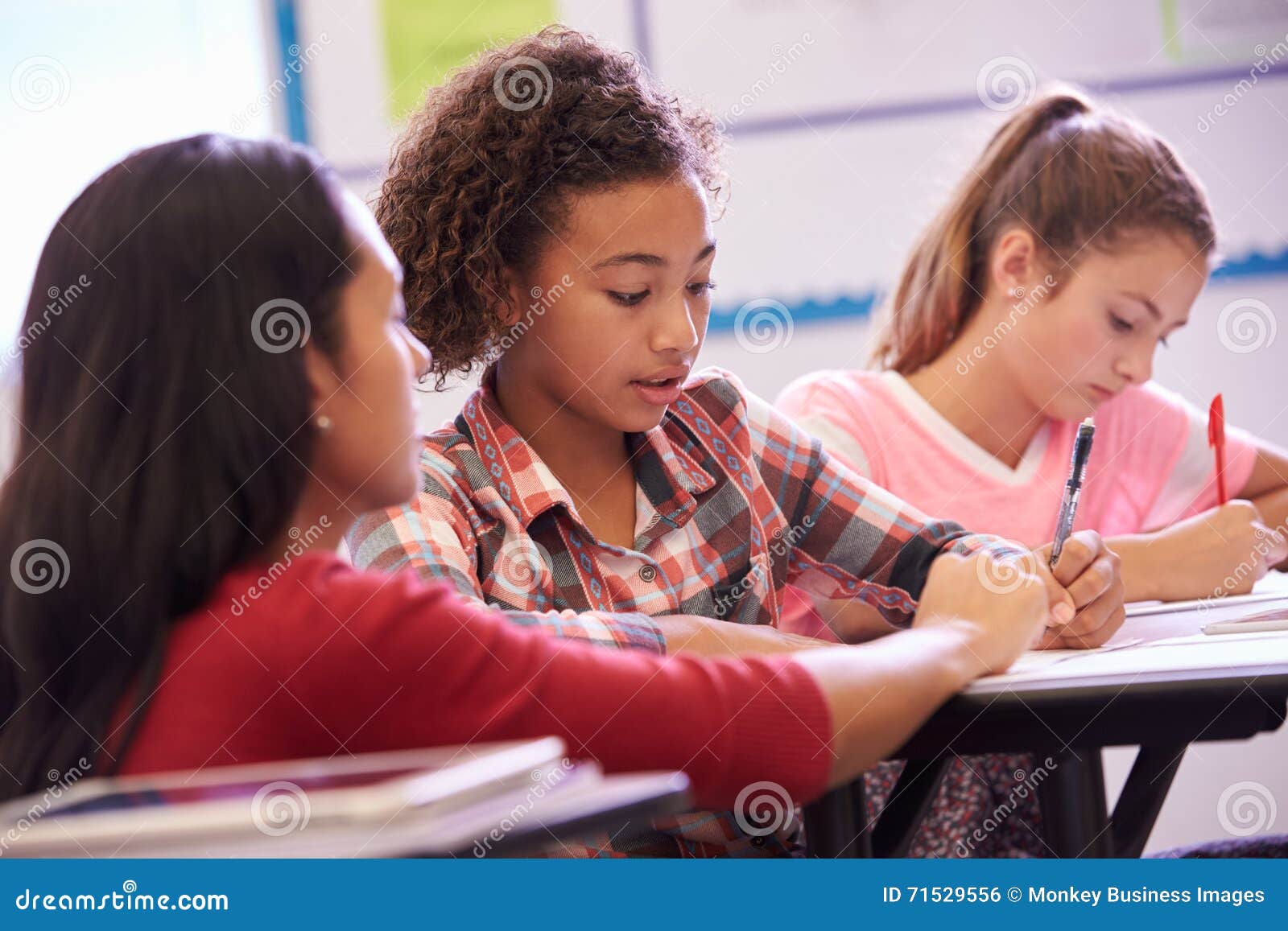 Teacher Helping Elementary School Pupils in Class Stock Photo - Image ...