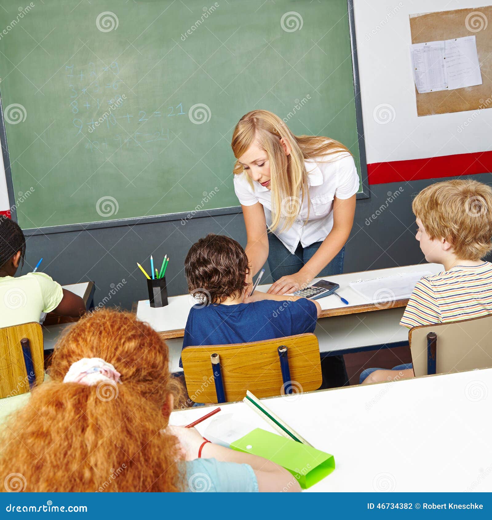 Teacher Helping Elementary School Students Stock Photo - Image of ... Teacher Helping Elementary School Students Stock Photo - Image of ...