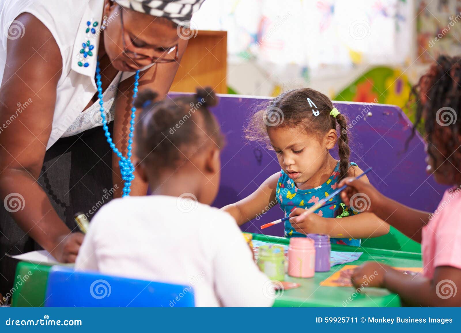 Teacher Helping Kids in a Preschool Class, Close Up Stock Image - Image ...