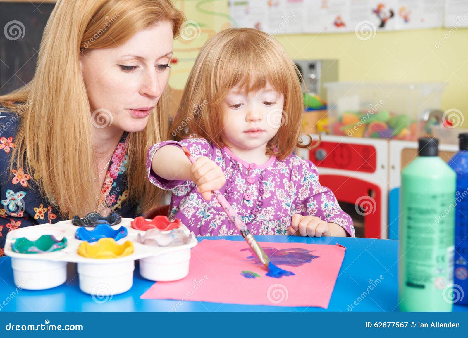 Teacher Helping Pre School Child in Art Class Stock Image - Image of ...