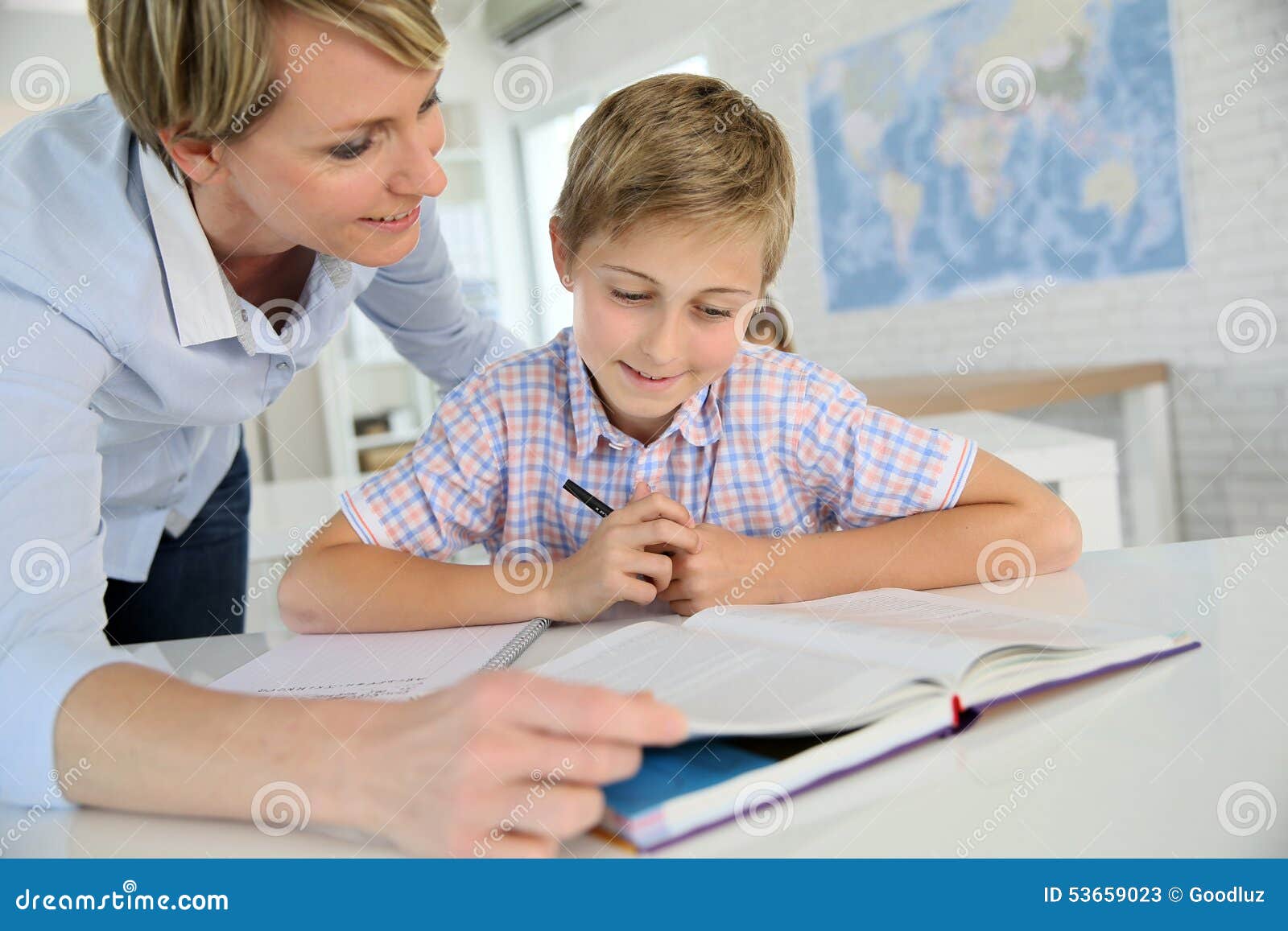 Teacher Helping Pupil in Class Stock Image - Image of people ...