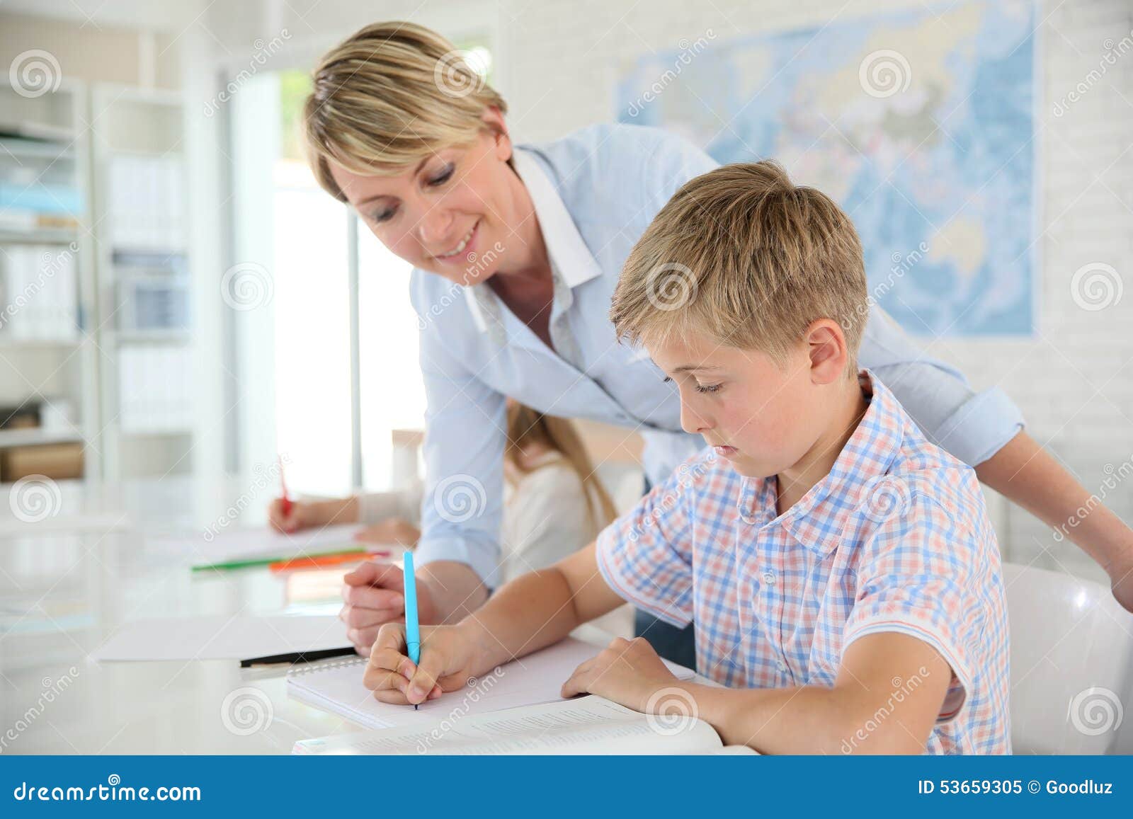 Teacher Helping Pupil in Class Stock Image - Image of student, sitting ...