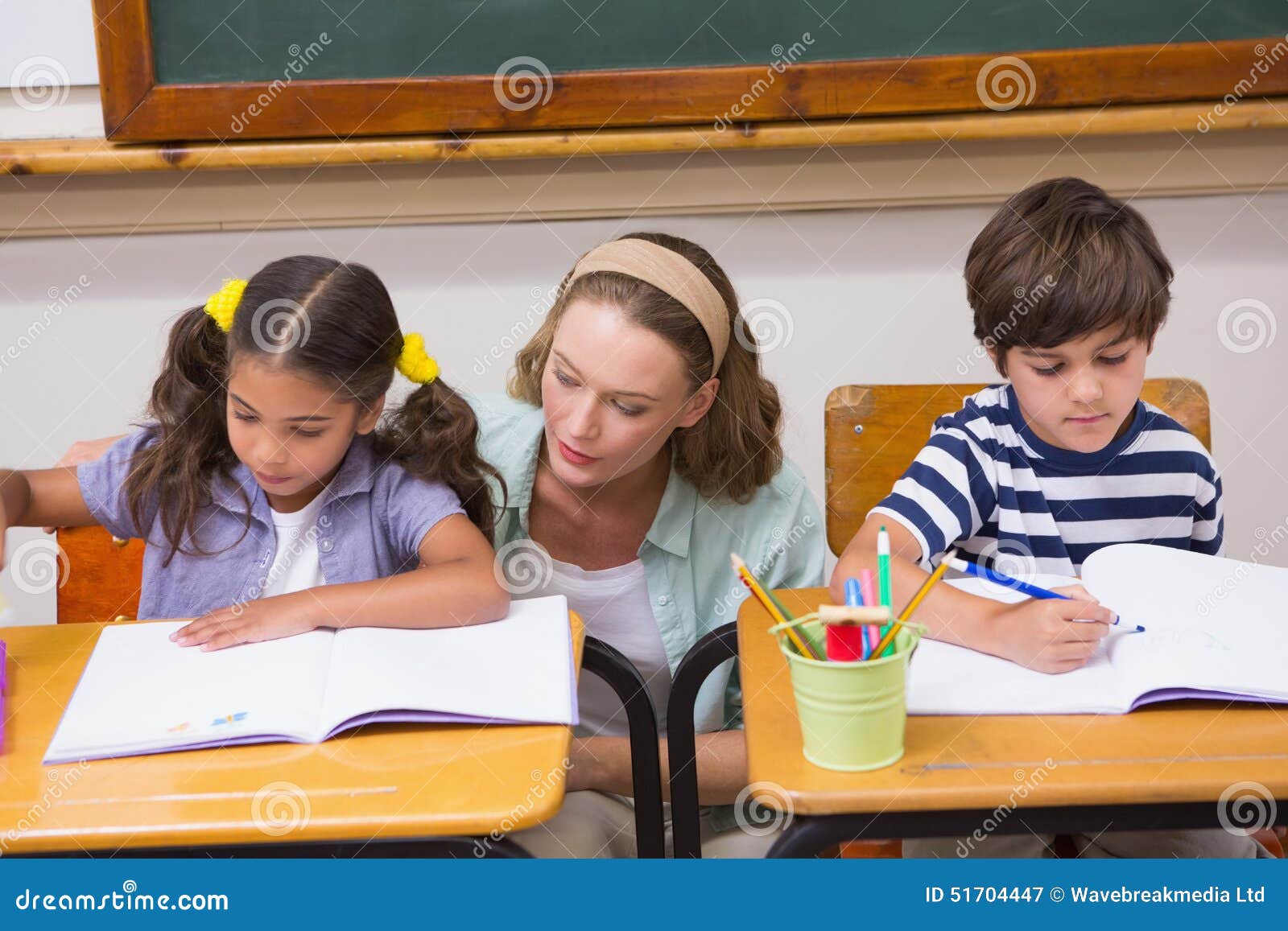 Teacher Helping Pupils in Classroom Stock Image - Image of adult, child ...