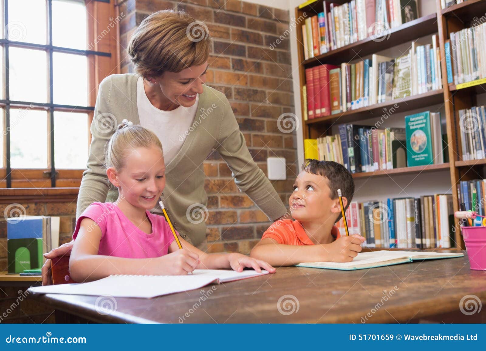 Teacher Helping Pupils in Library Stock Image - Image of development ...