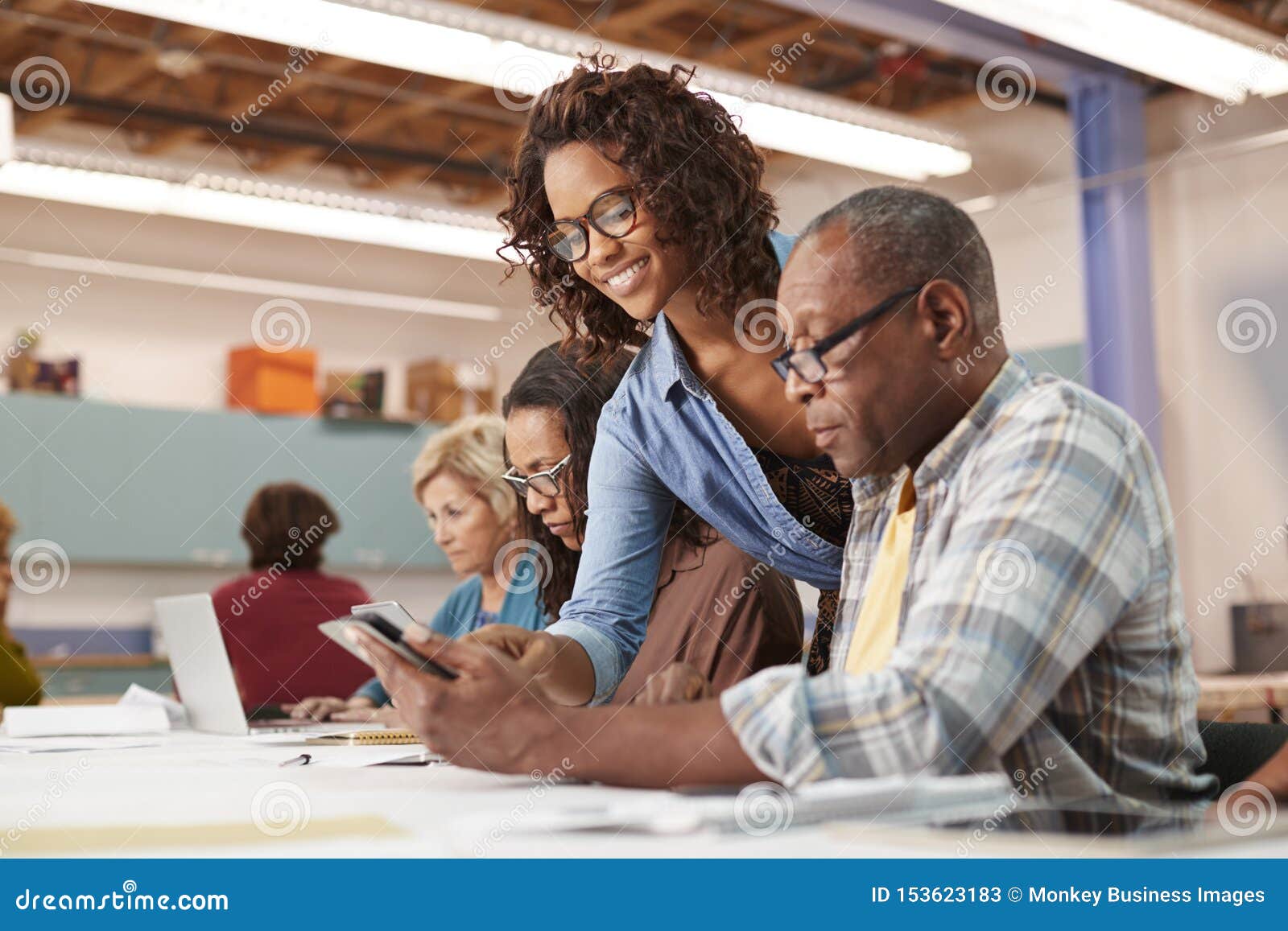 Teacher Helping Retired Senior Man Attending it Class in Community ...