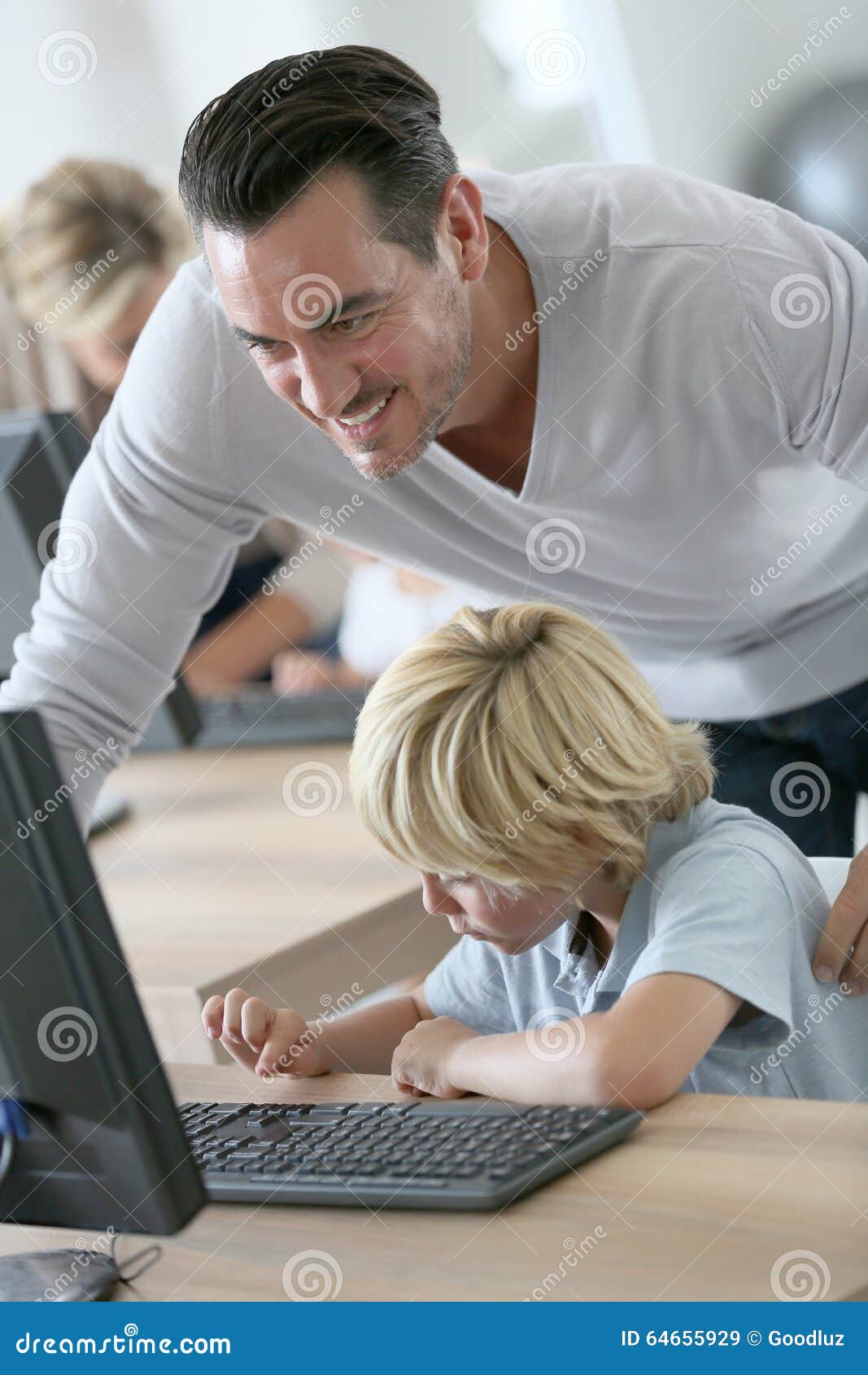Teacher Helping a School Boy with Computer Stock Image - Image of desk ...