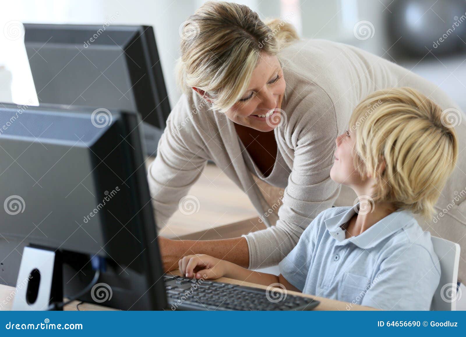Teacher Helping School Boy with Computer Stock Photo - Image of people ...
