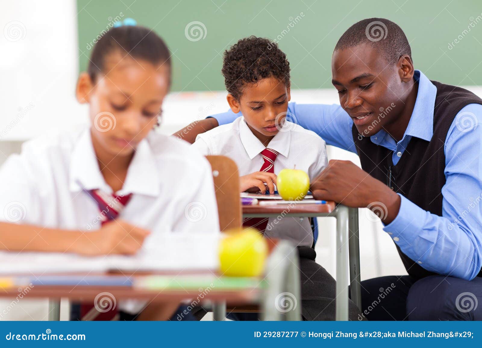 Teacher helping student stock image. Image of female - 29287277