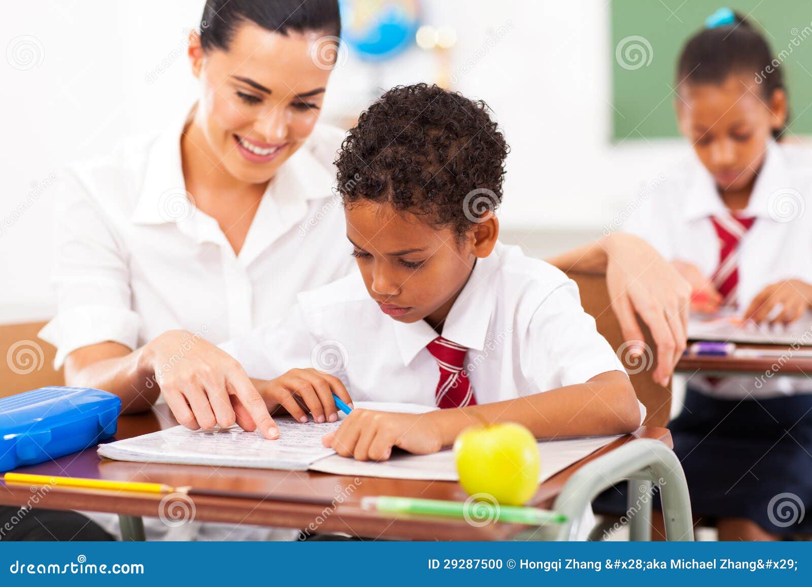 Teacher helping student stock photo. Image of cute, elementary - 29287500
