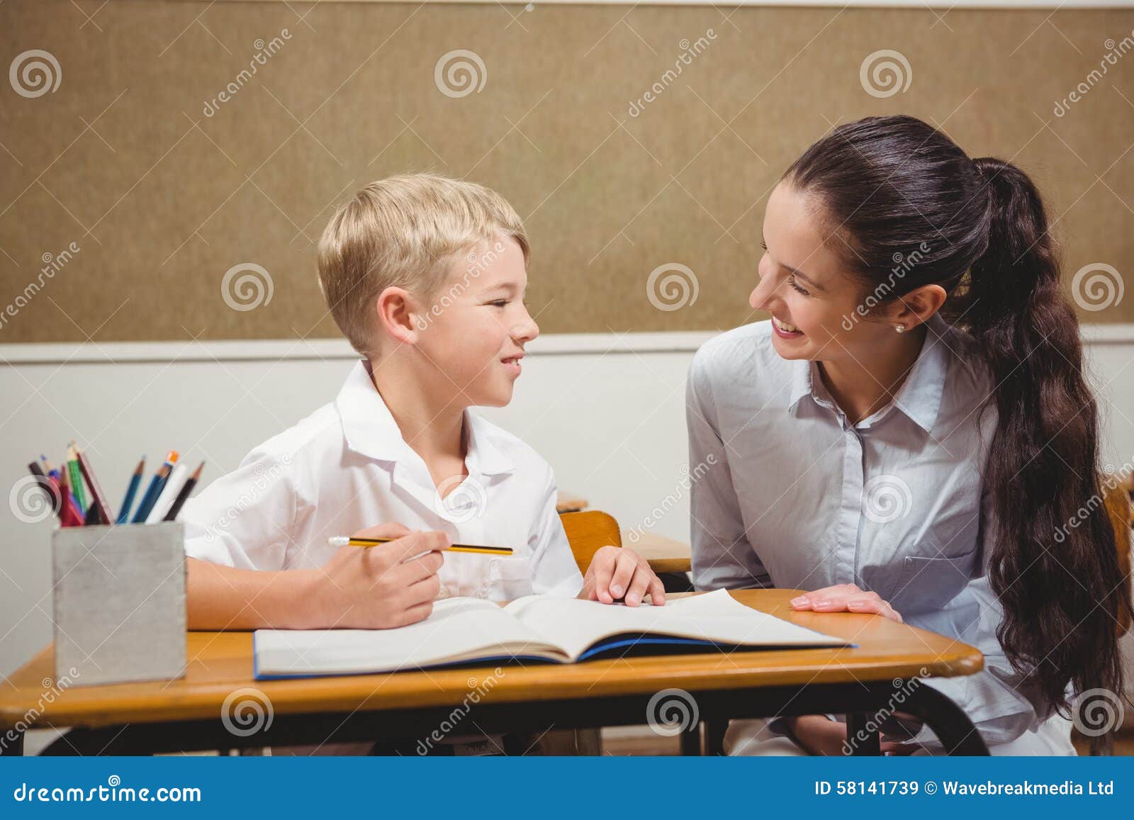 Teacher Helping a Student in Class Stock Image - Image of school ...