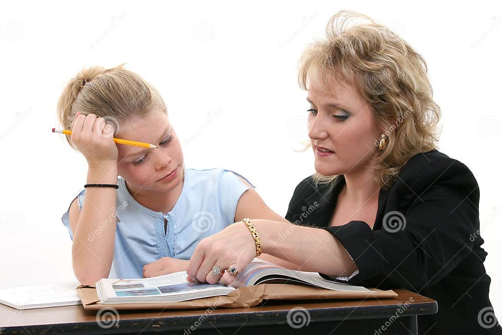Teacher Helping Student at Desk Stock Image - Image of adolescent ...