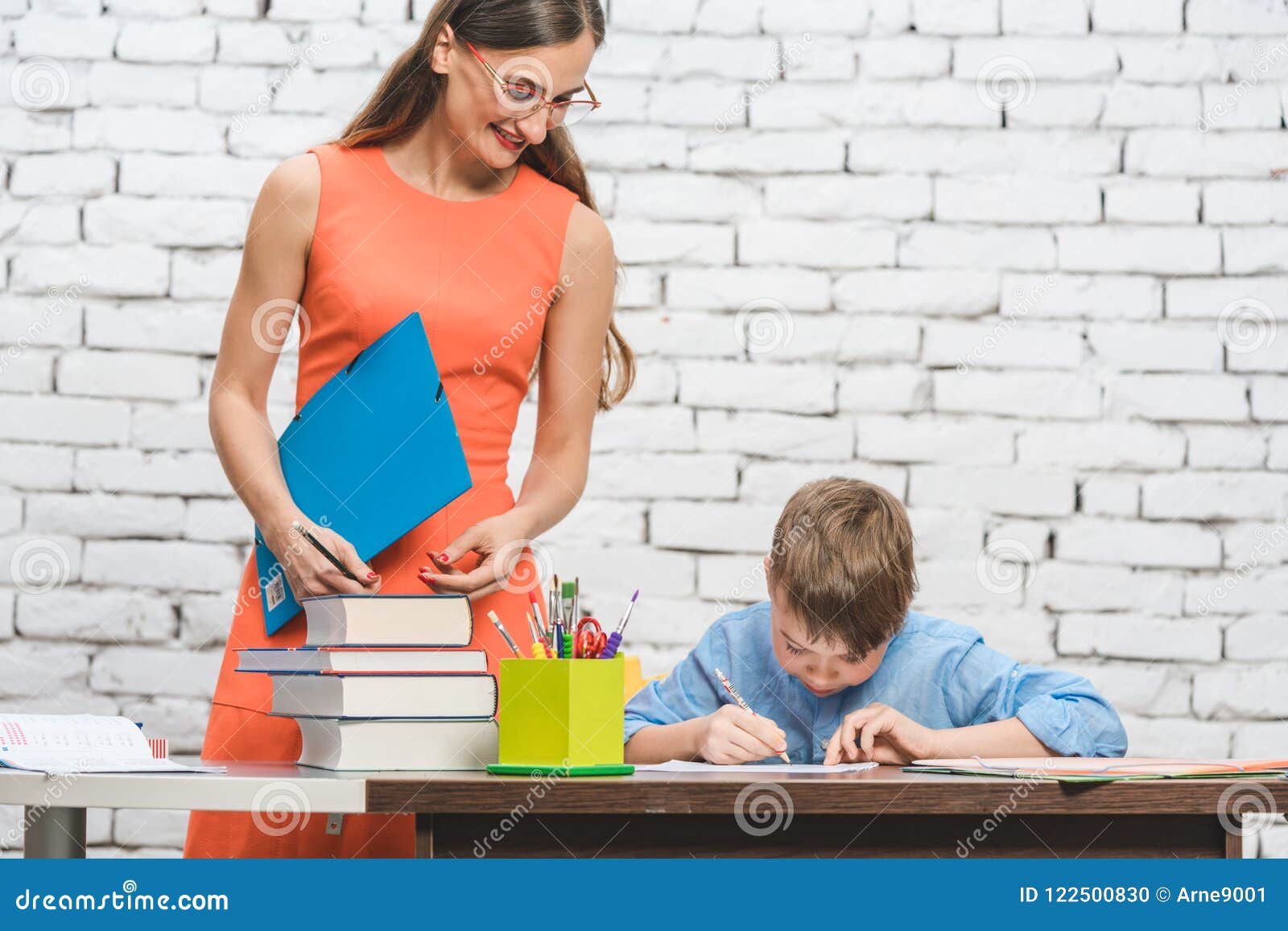 Teacher Helping Student with Difficult Task in School Stock Photo ...