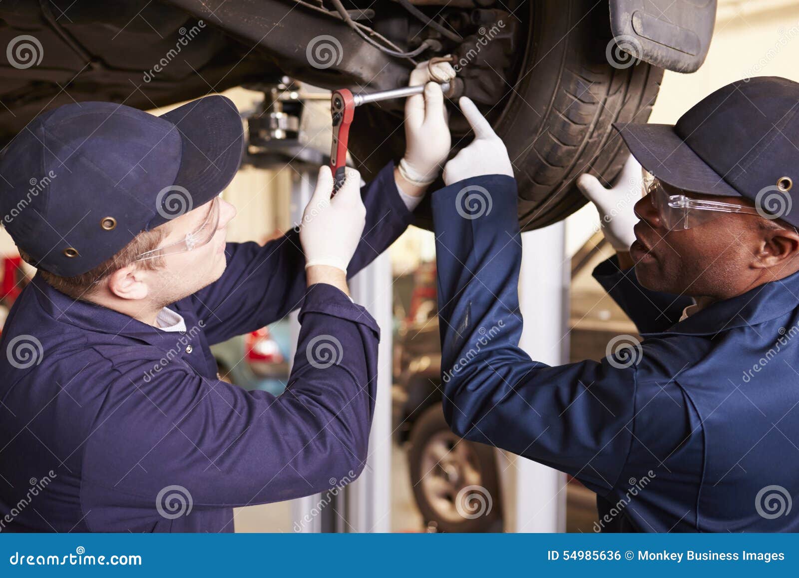 Teacher Helping Student Training To Be Car Mechanics Stock Photo ...