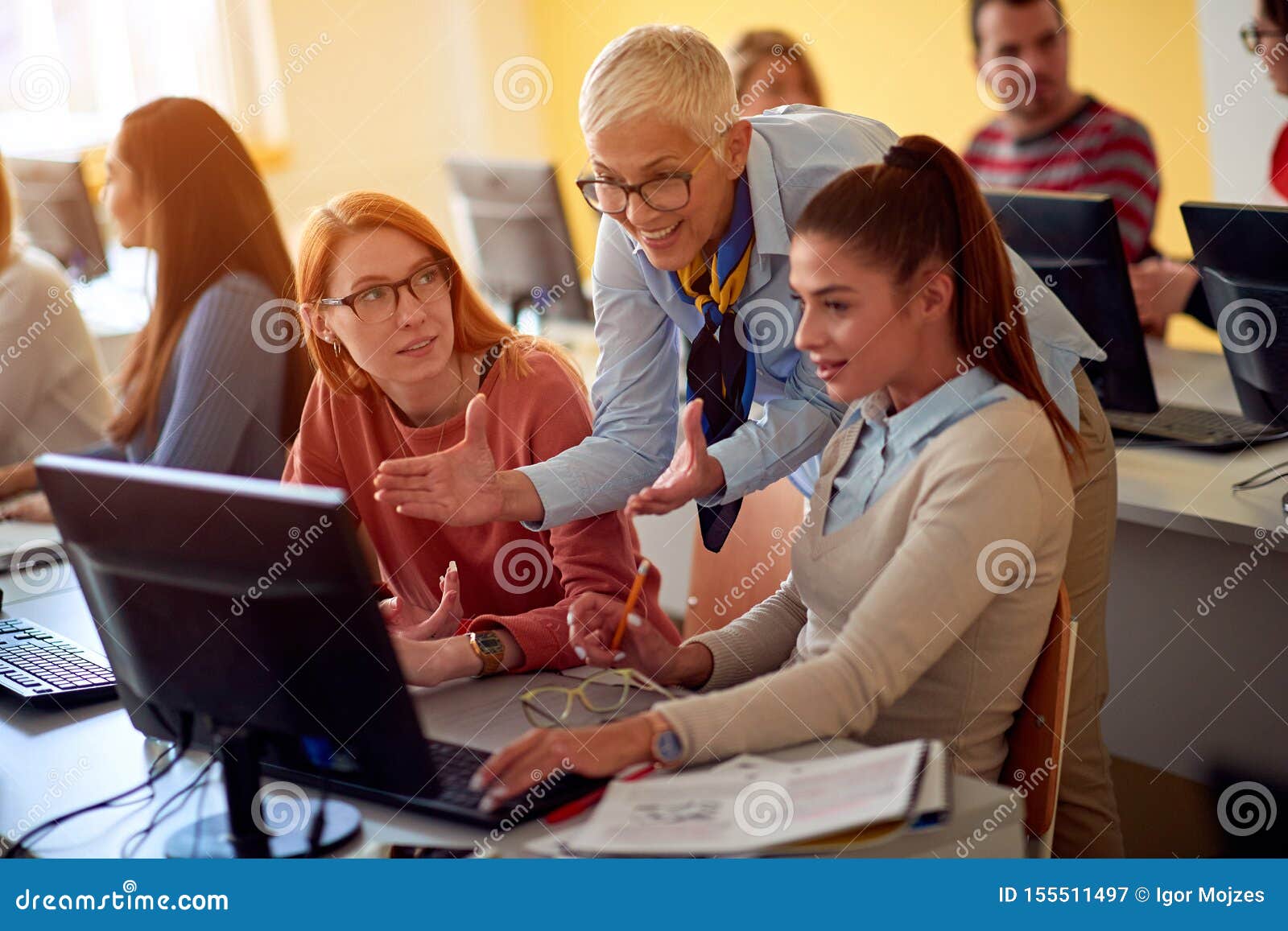 Teacher Helping Students on Project on University Campus Stock Image ...