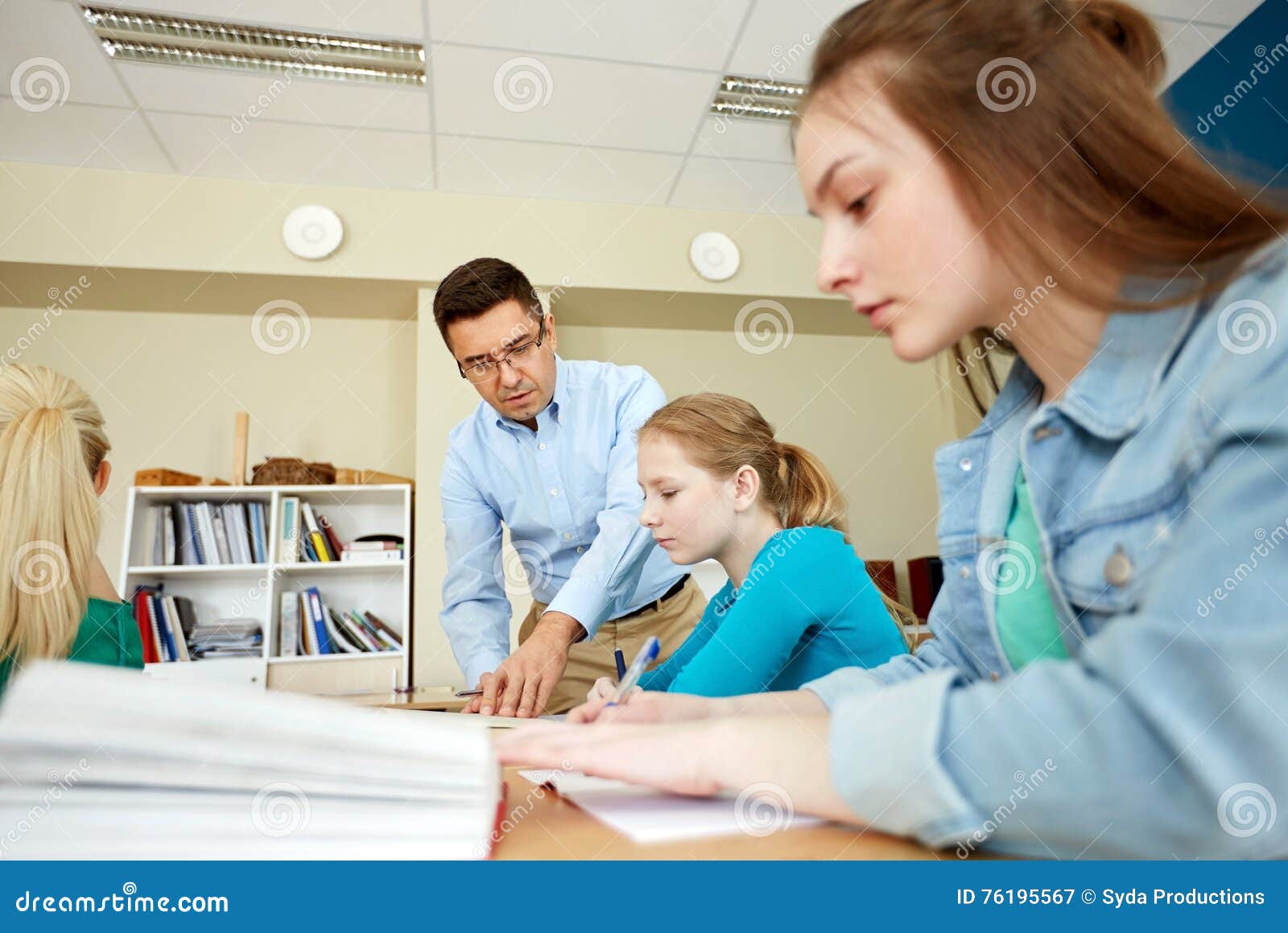 Teacher Helping Students with Task at School Stock Image - Image of ...