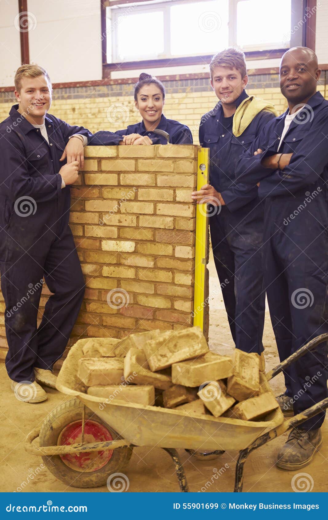 Teacher Helping Students Training To Be Builders Stock Image - Image of ...