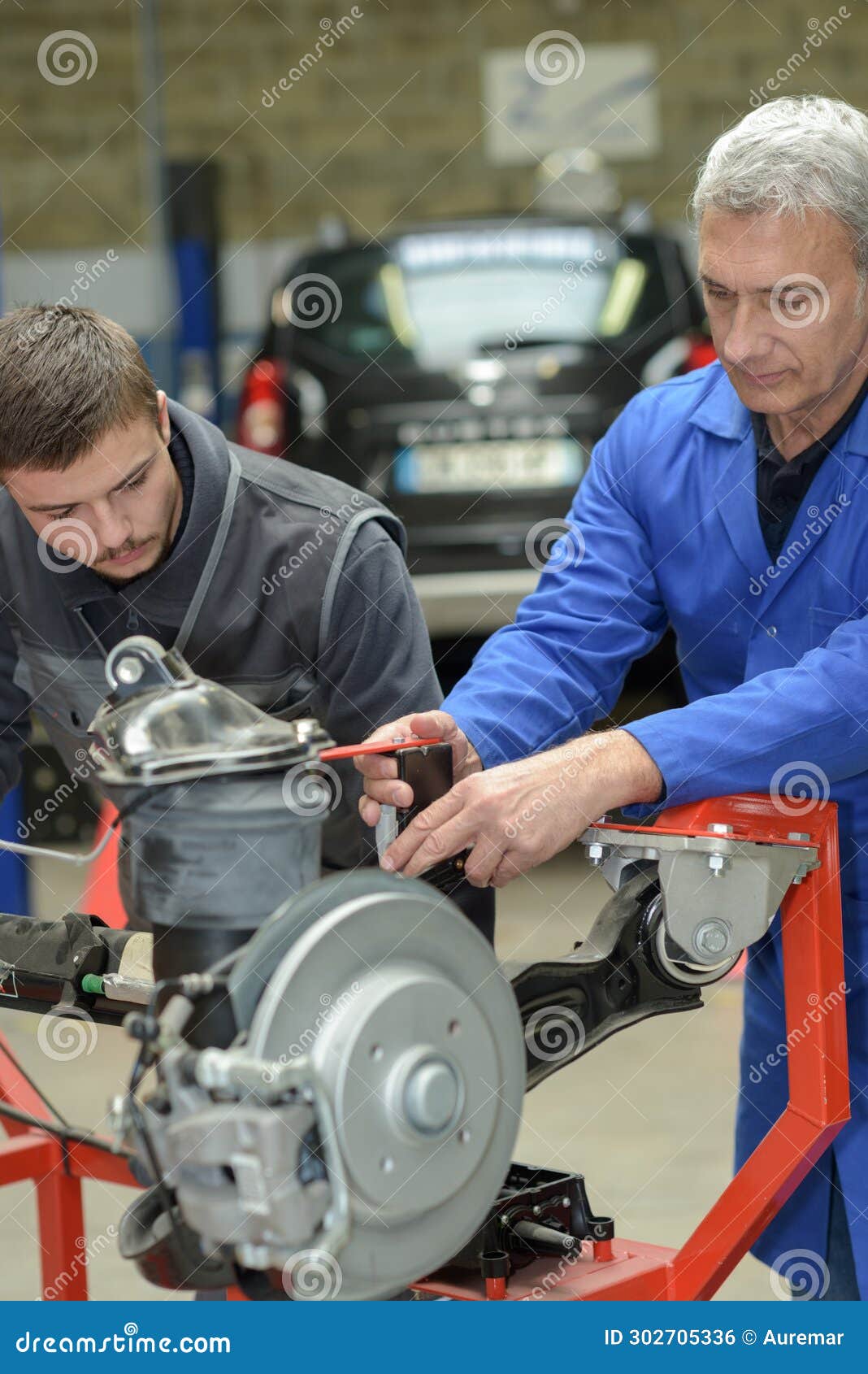 Teacher Helping Students Training To Be Car Mechanics Stock Photo ...
