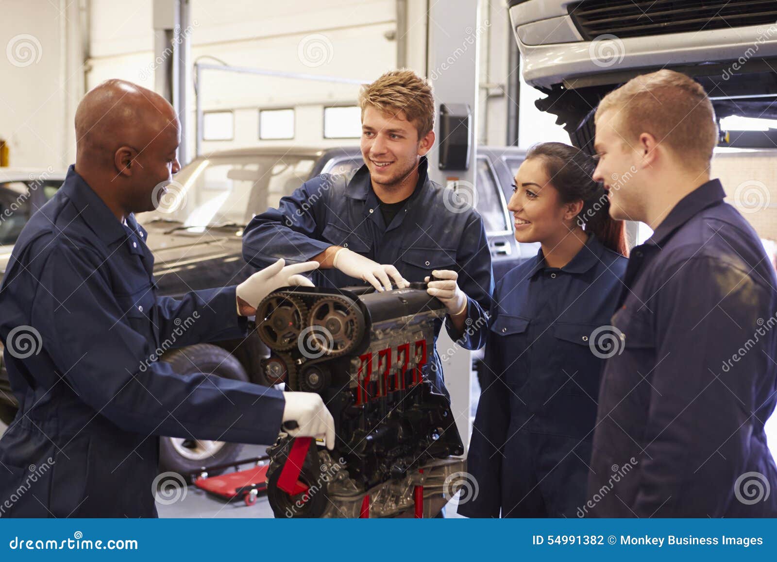 Teacher Helping Students Training To Be Car Mechanics Stock Photo ...