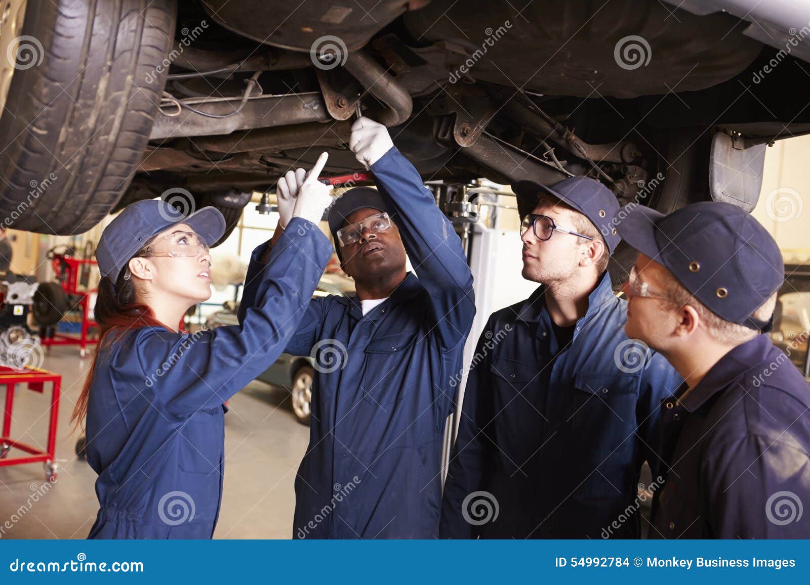 Teacher Helping Students Training To Be Car Mechanics Stock Photo ...