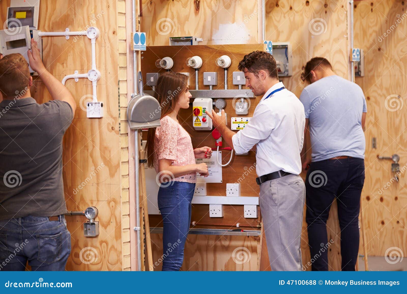 Teacher Helping Students Training To Be Electricians Stock Photo ...