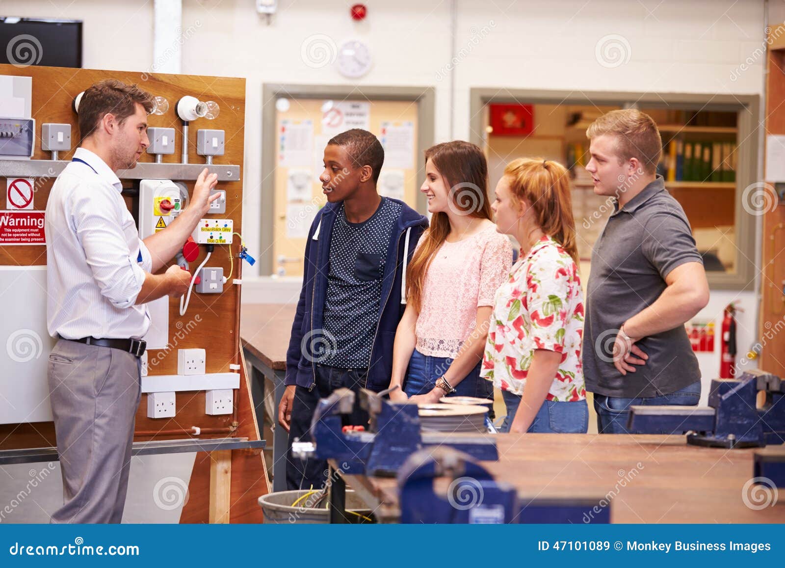 Teacher Helping Students Training To Be Electricians Stock Image ...