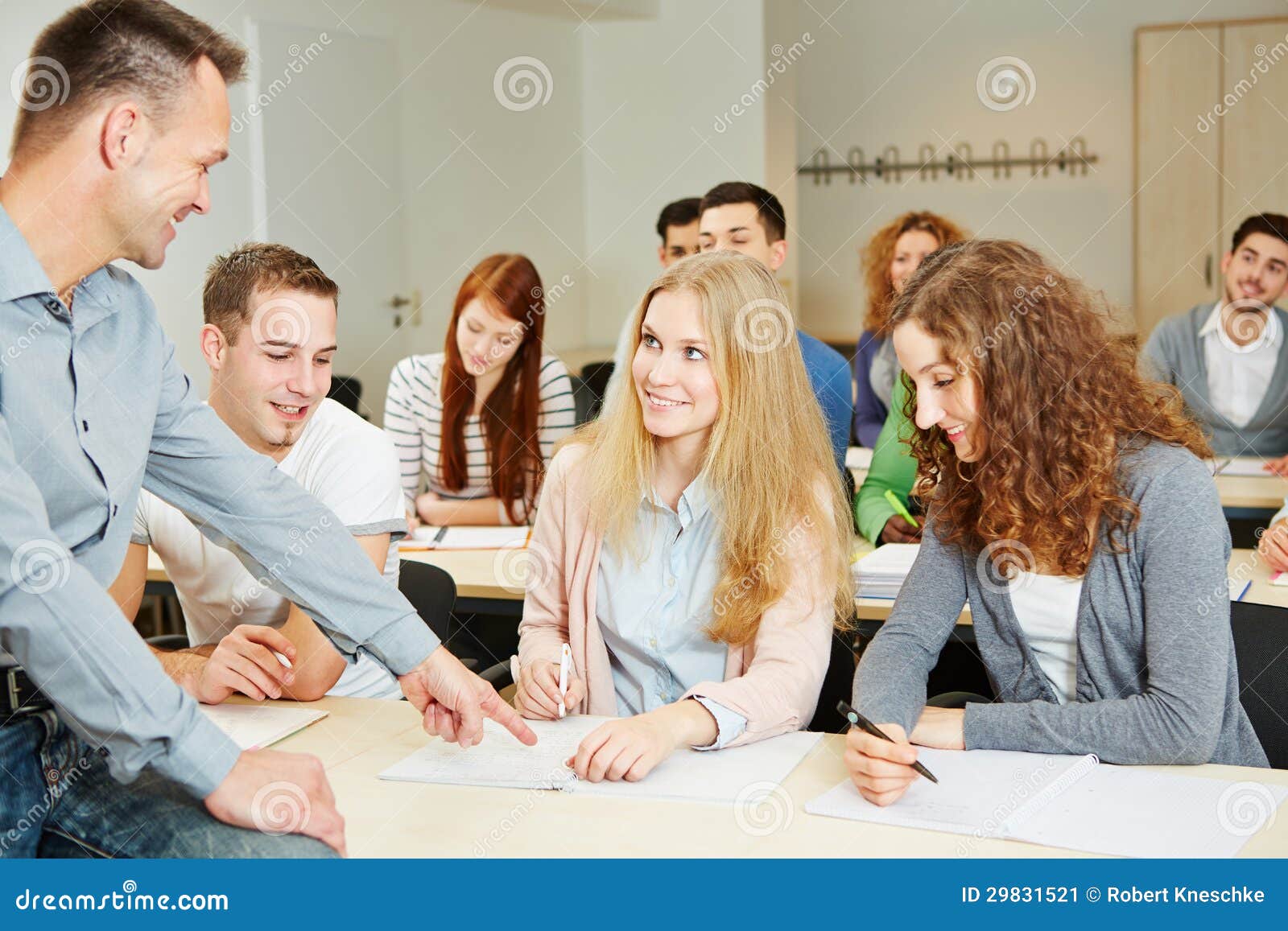 Teacher Helping Students in University Class Stock Image - Image of ...