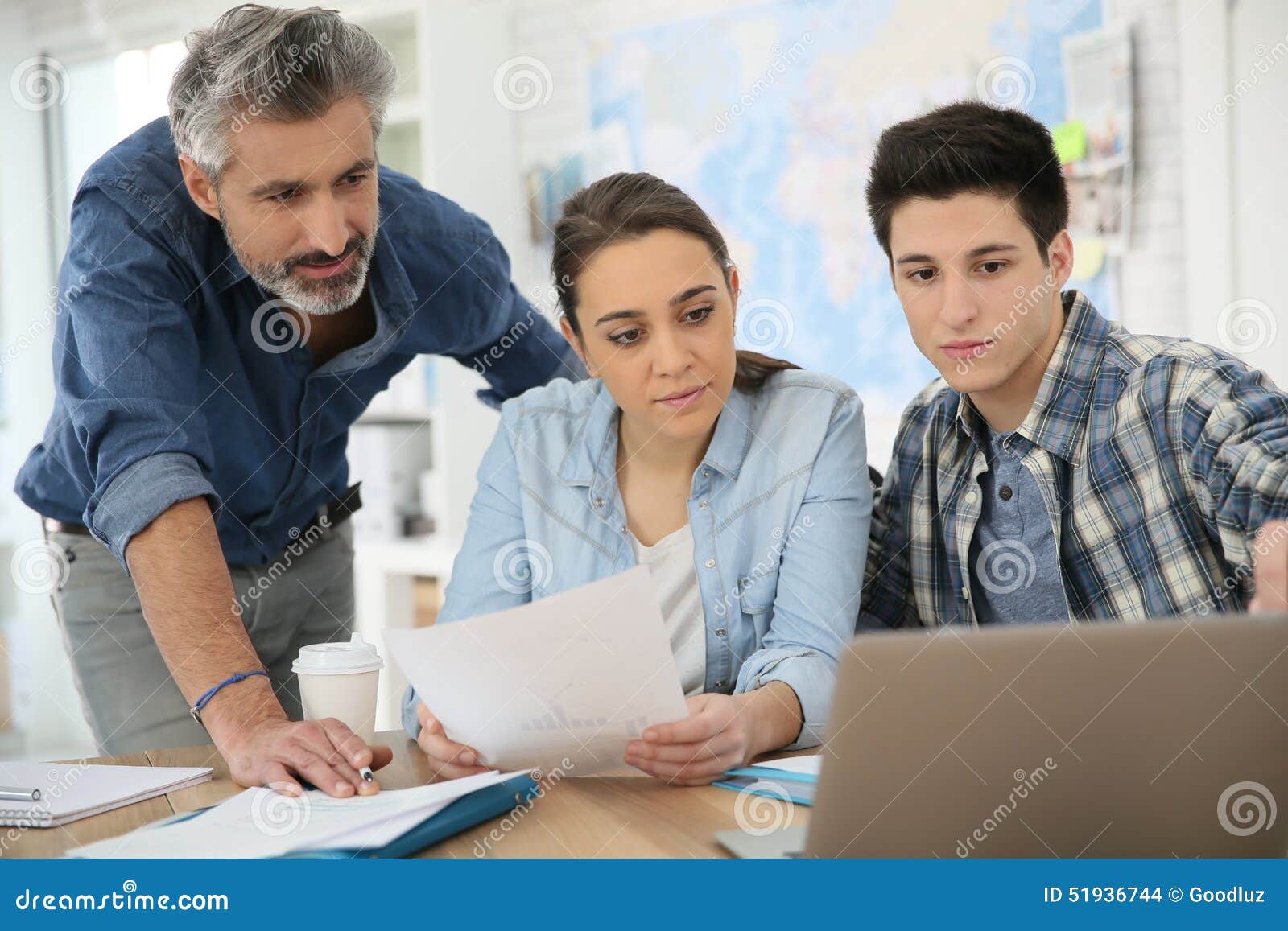 Teacher Helping Students Working on Project Stock Photo - Image of ...