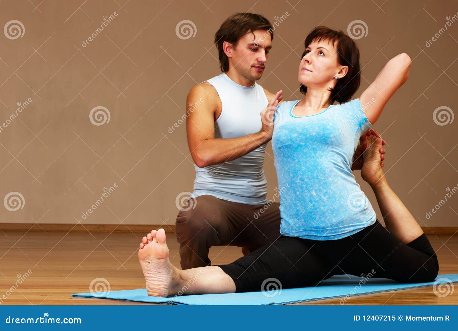 Teacher Helping with Yoga Pose Stock Image - Image of adult, male: 12407215