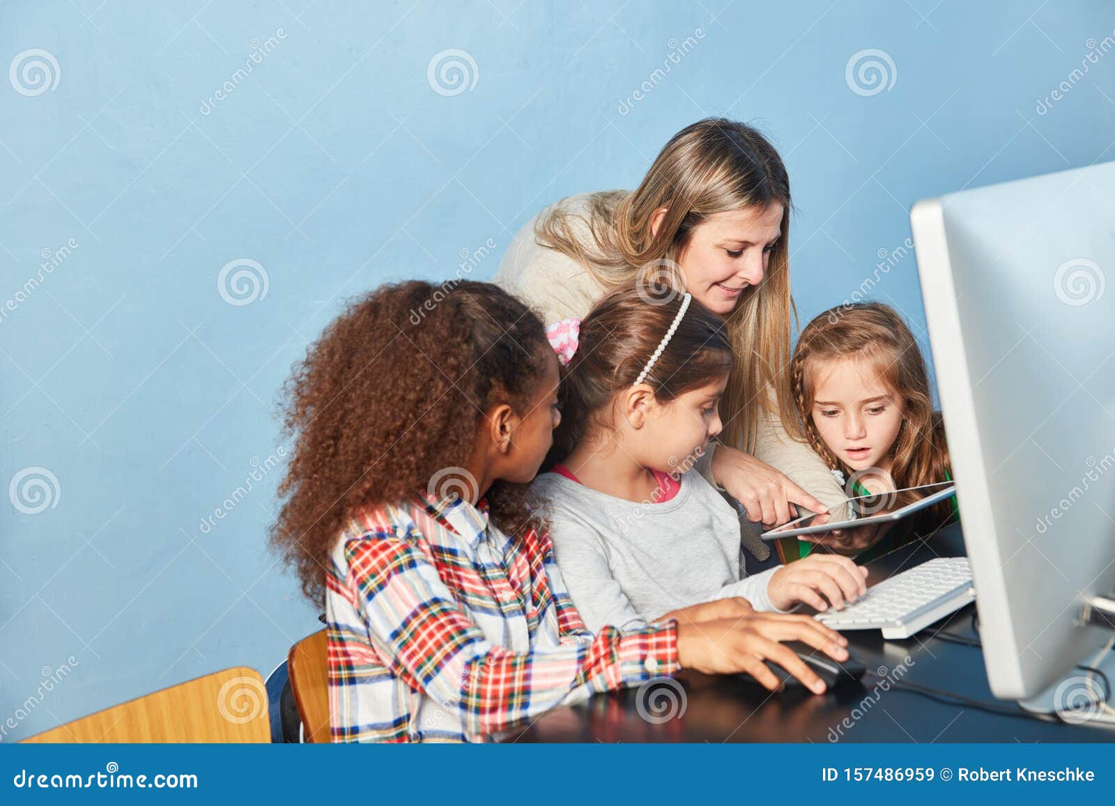 Teacher Helps Children on the Computer Stock Image - Image of ...