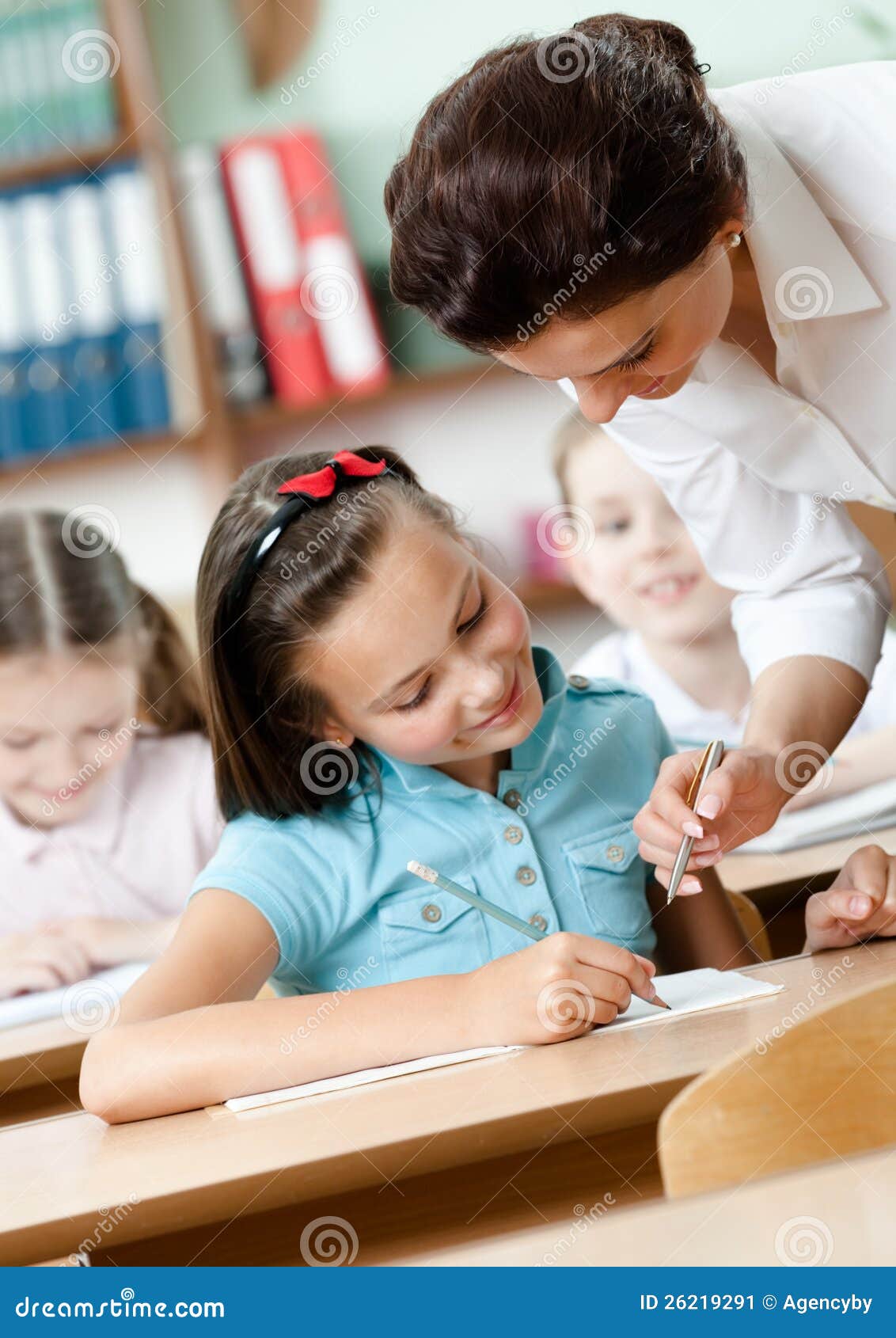 Teacher Helps Pupils To Do the Task Stock Image - Image of beautiful ...