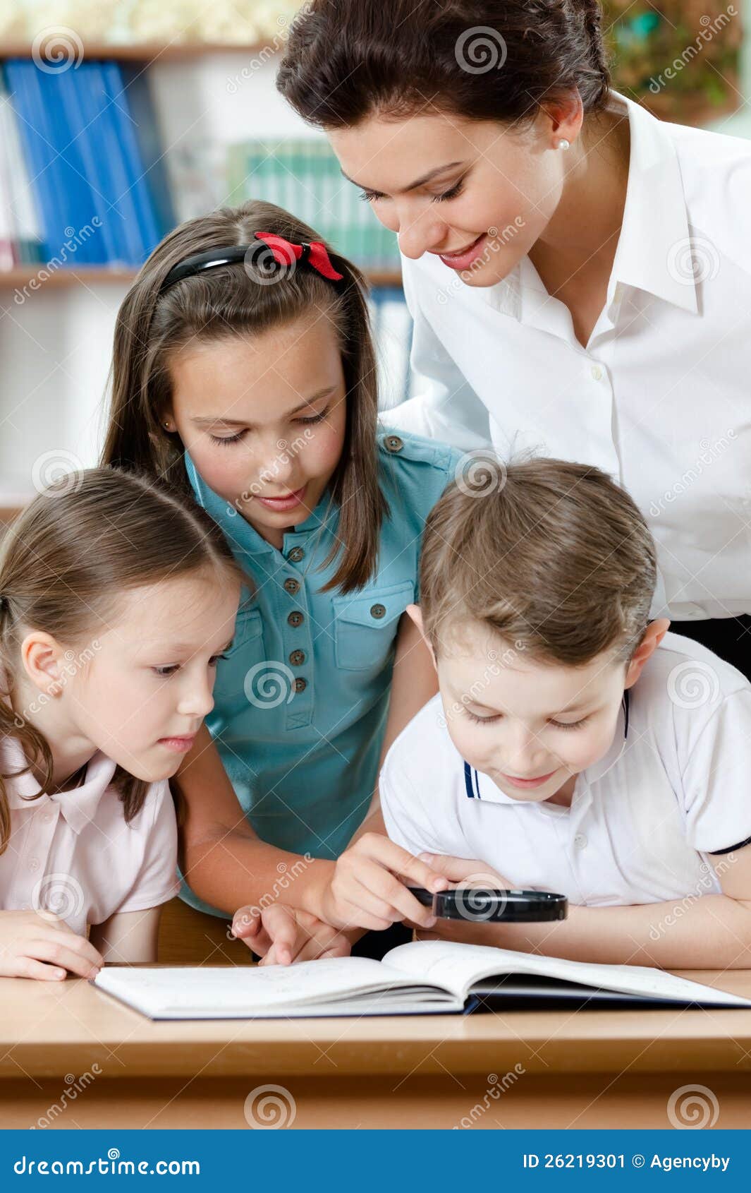Teacher with Her Pupils Examine Something Stock Image - Image of ...