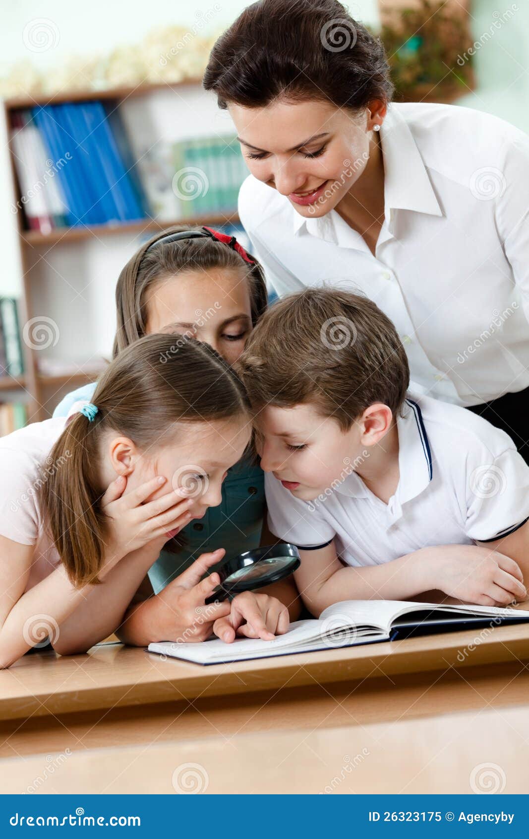 Teacher with Her Pupils Examine Something Stock Image - Image of ...