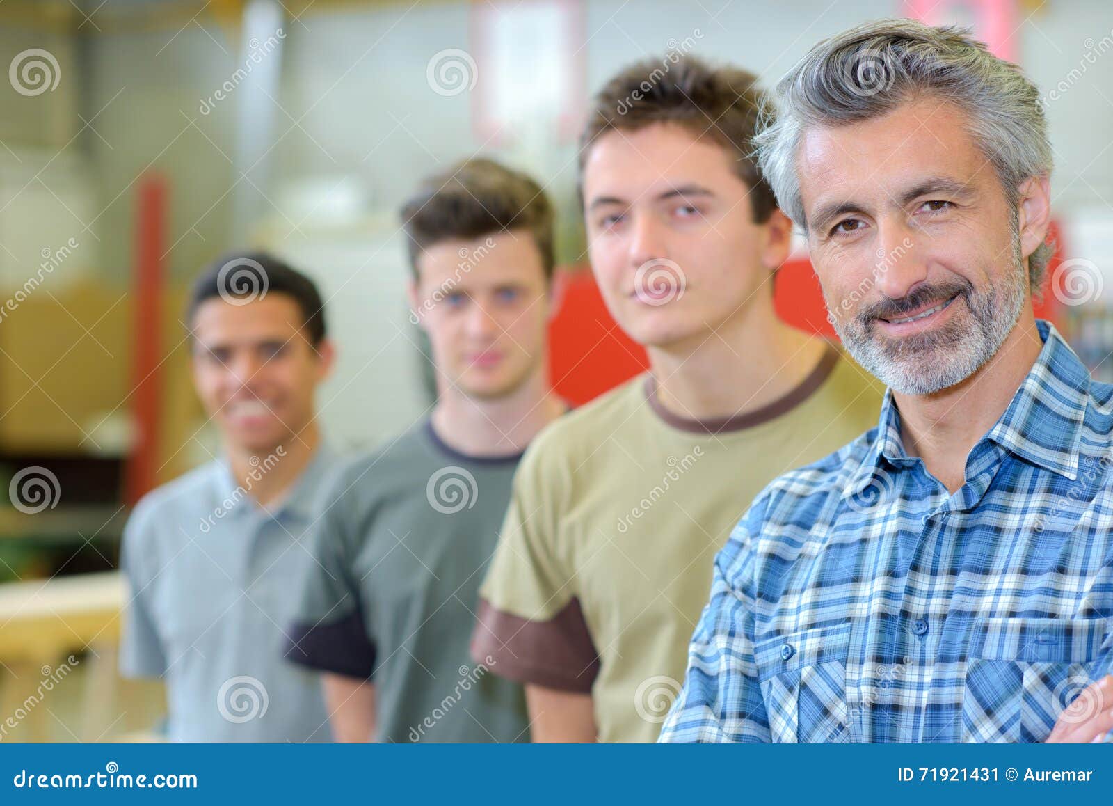 Teacher with His Students Lined Up beside Him Stock Image - Image of ...