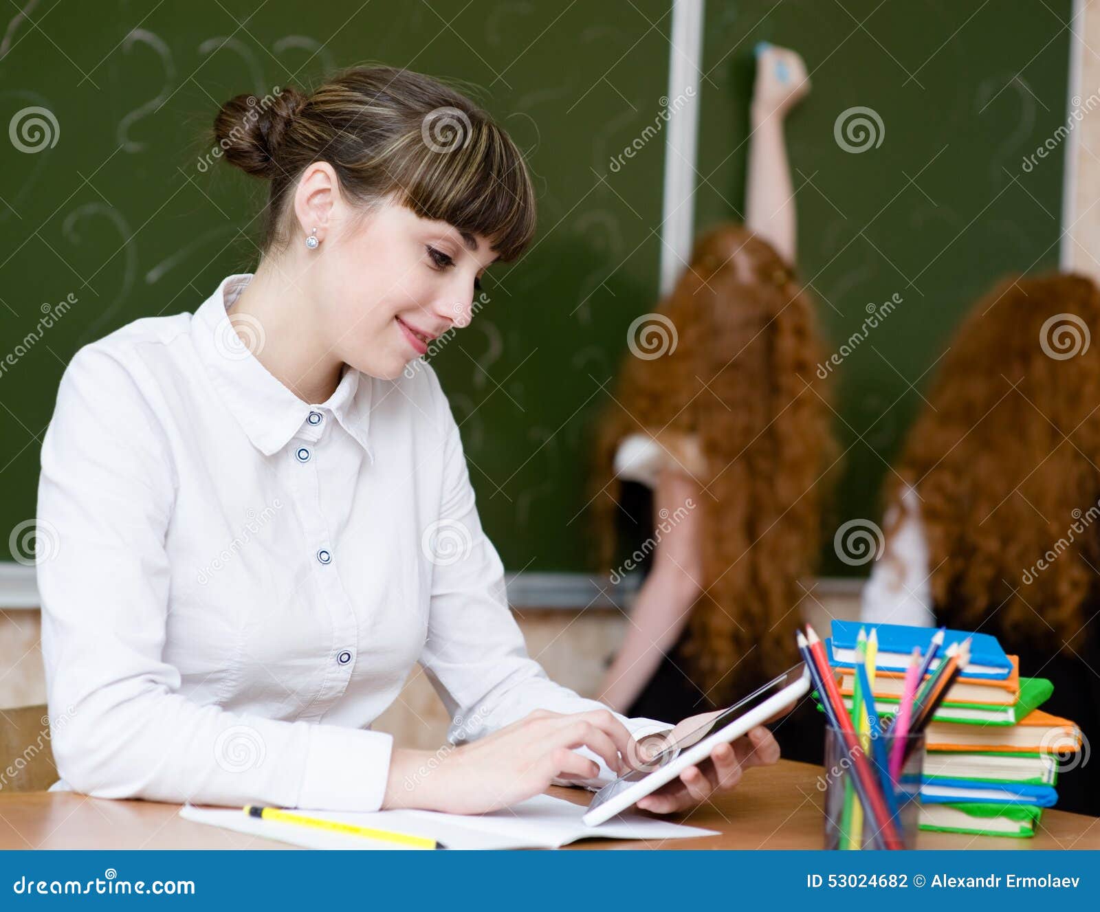 Teacher Holding a Tablet Computer at Classroom Stock Photo - Image of ...