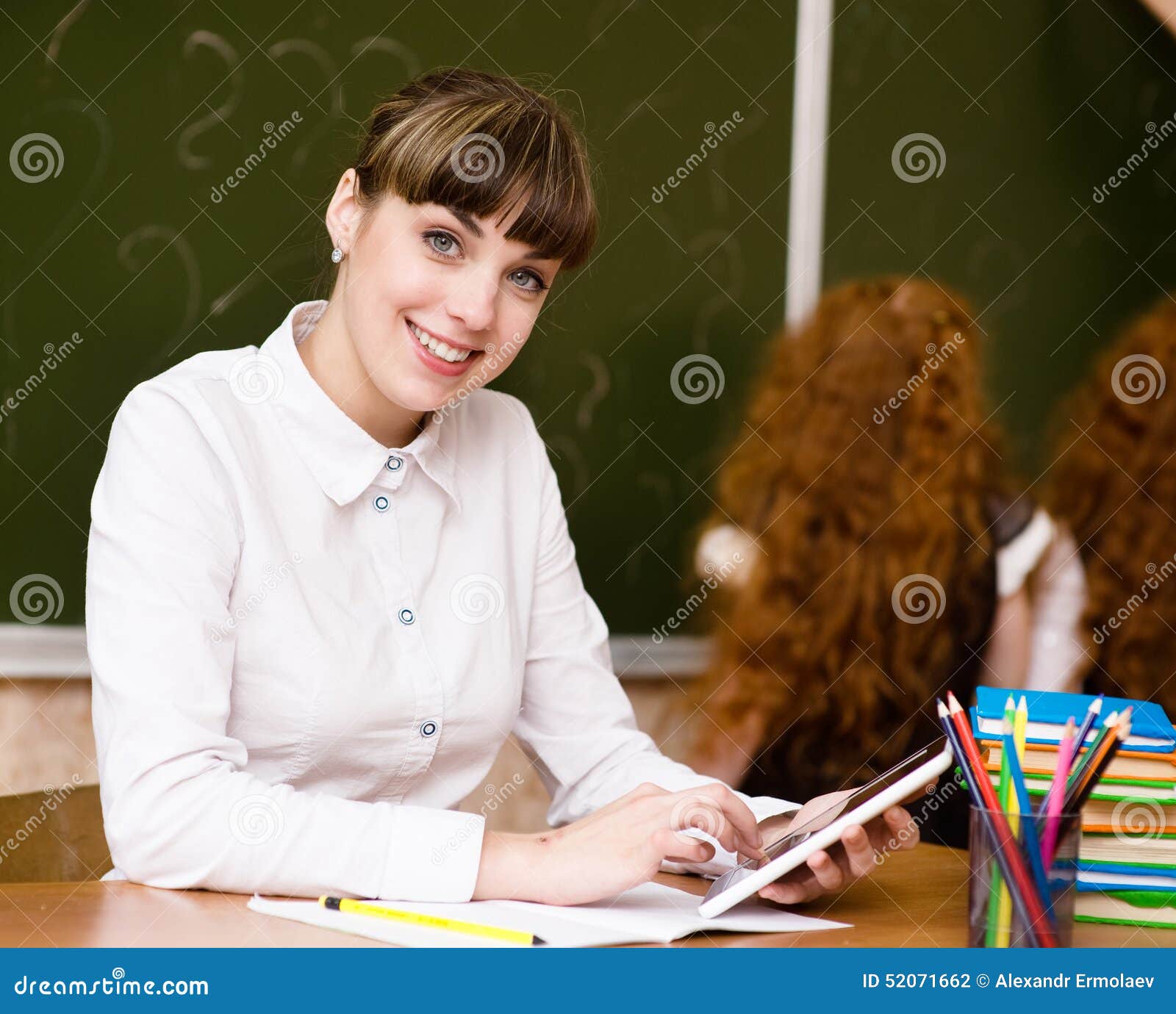 Teacher Holding a Tablet Computer at Classroom Stock Photo - Image of ...