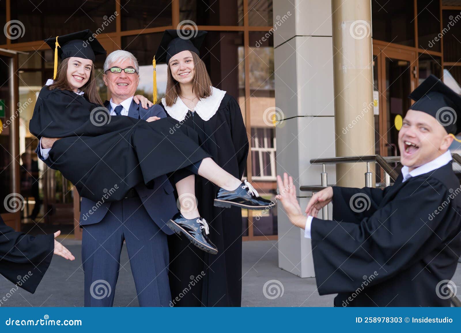 The Teacher Holds the Graduate in His Arms. Stock Image - Image of ...