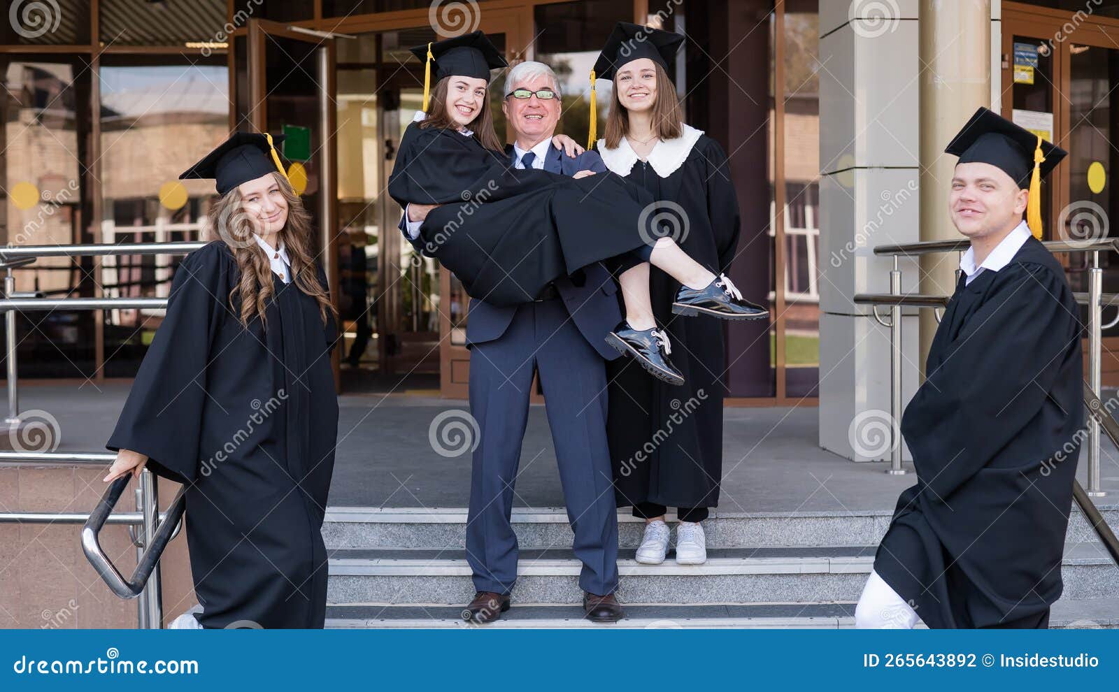 The Teacher Holds the Graduate in His Arms. Stock Photo - Image of ...