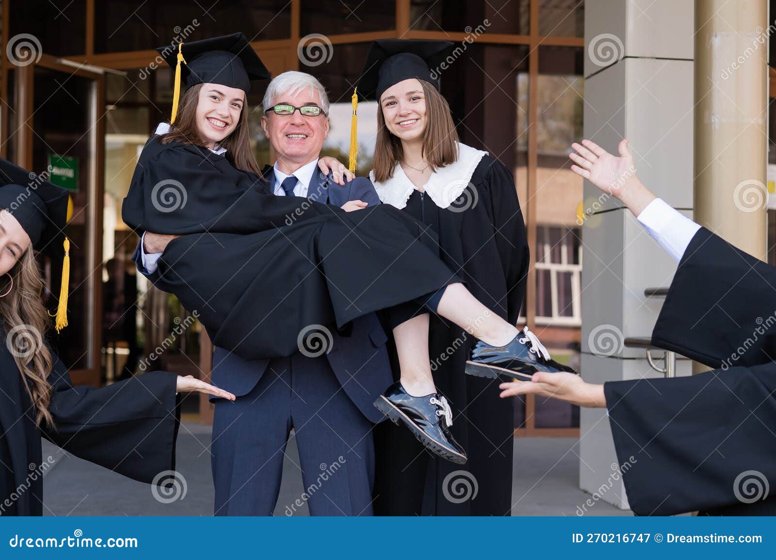 The Teacher Holds the Graduate in His Arms. Stock Image - Image of ...